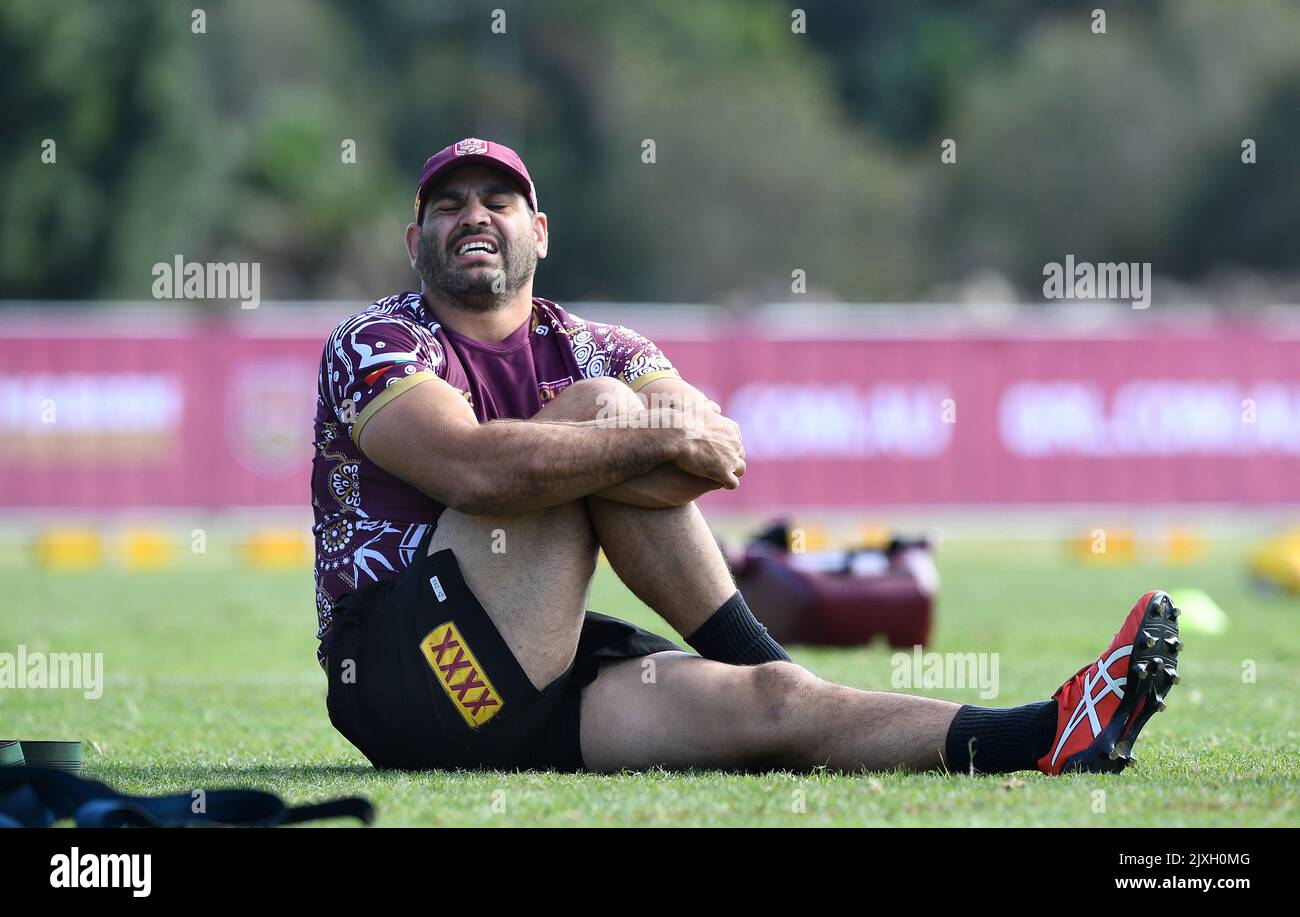 Greg Inglis stretches during the Queensland State of Origin team ...