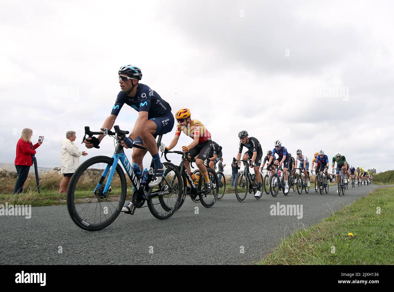 The peloton passes Whitby Abbey during stage four of the AJ Bell Tour ...