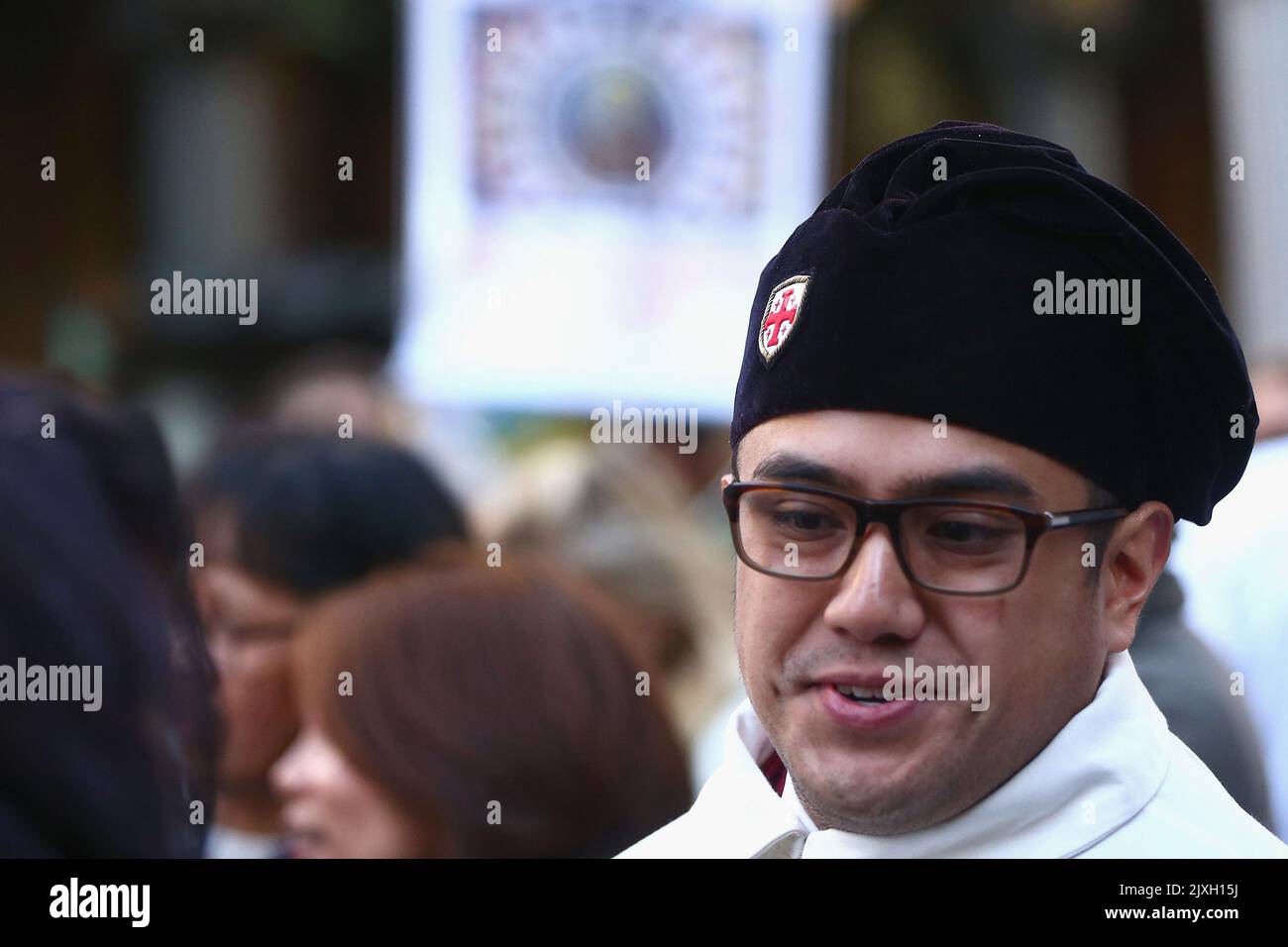 A priest looks on during a Catholic March in Sydney on Sunday, June 3 ...
