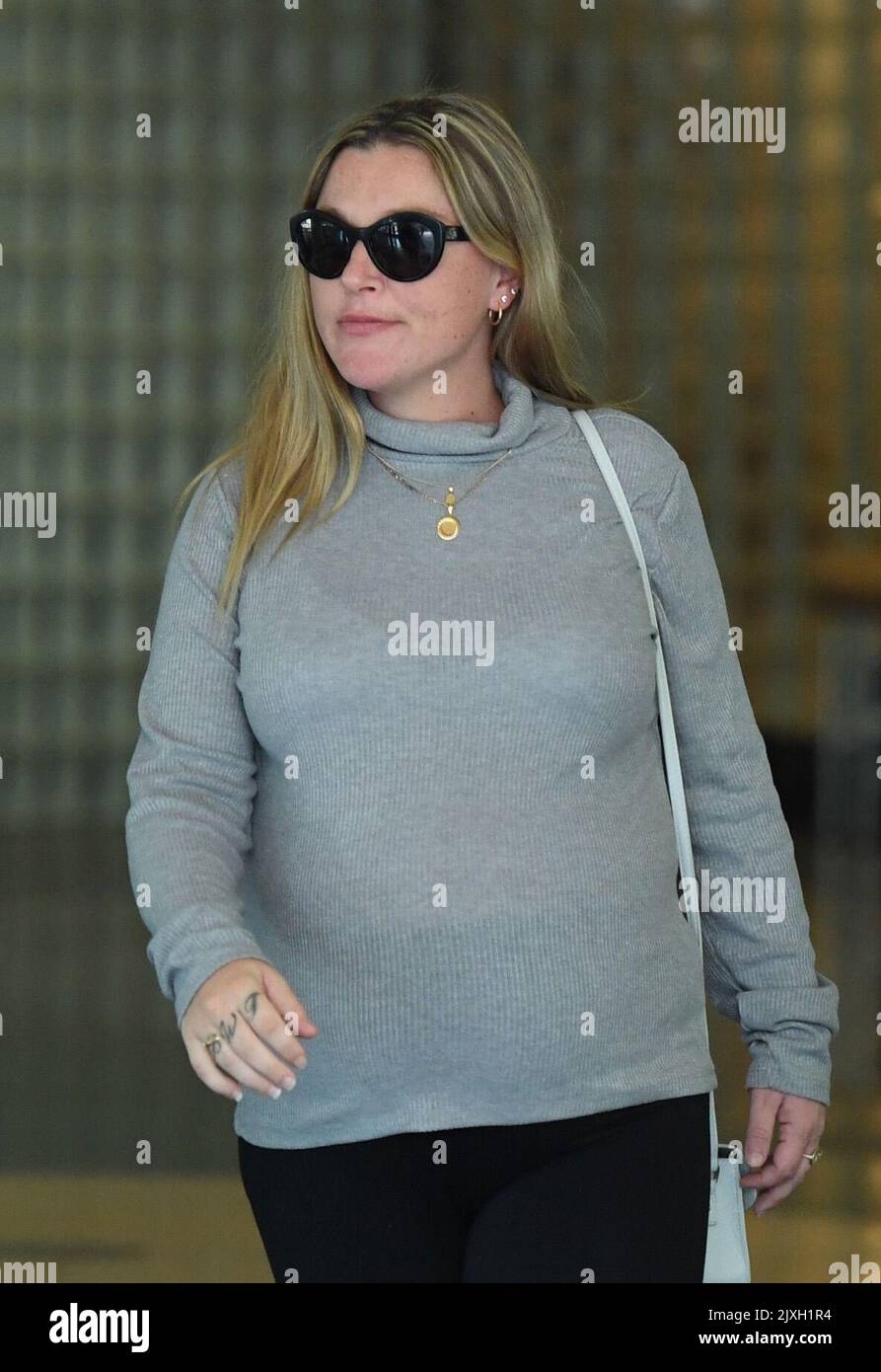 Monique Hayes leaves the Downing Centre Courts in Sydney, Monday, June ...