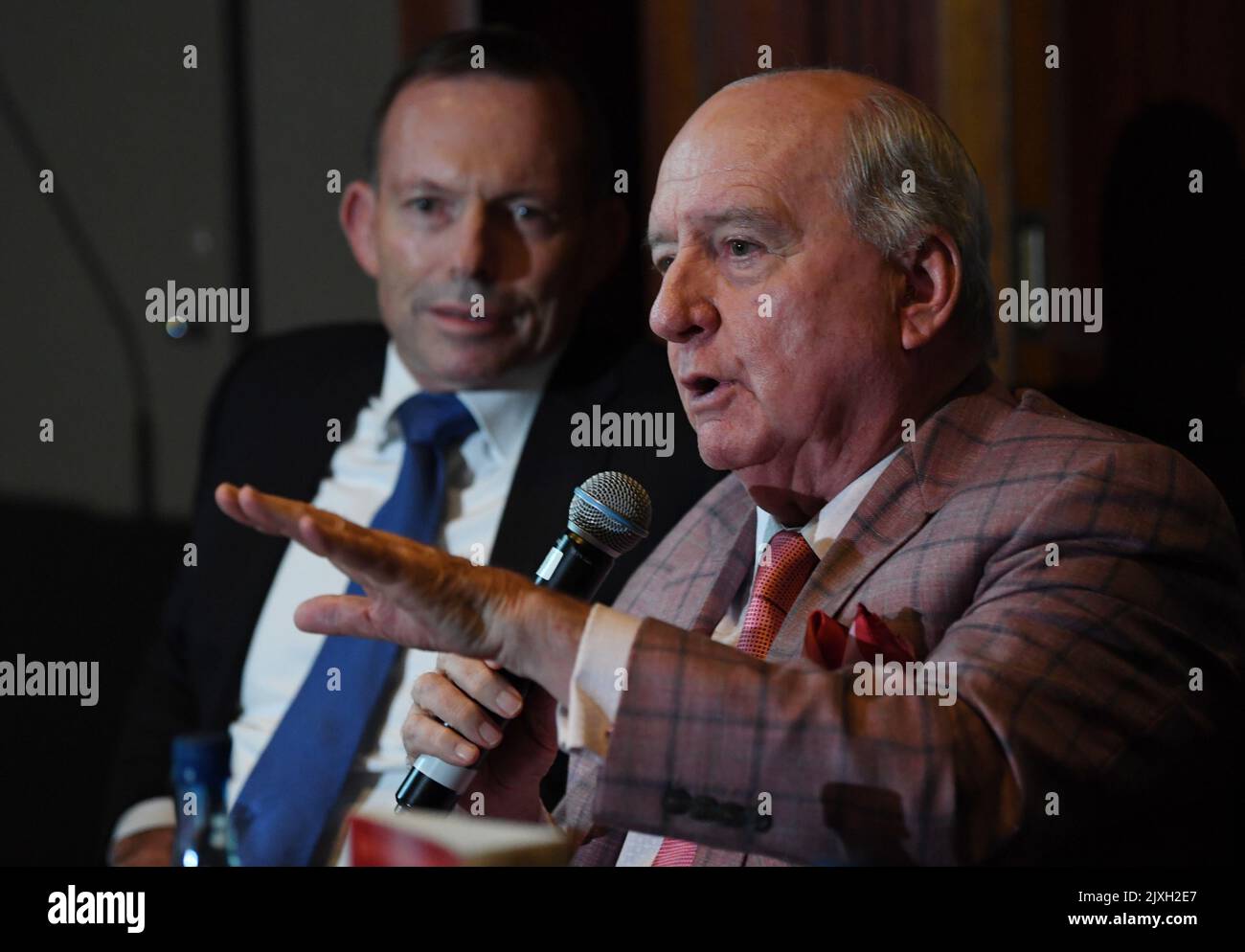 Radio shock jock Alan Jones gestures as he speaks sitting next to ...