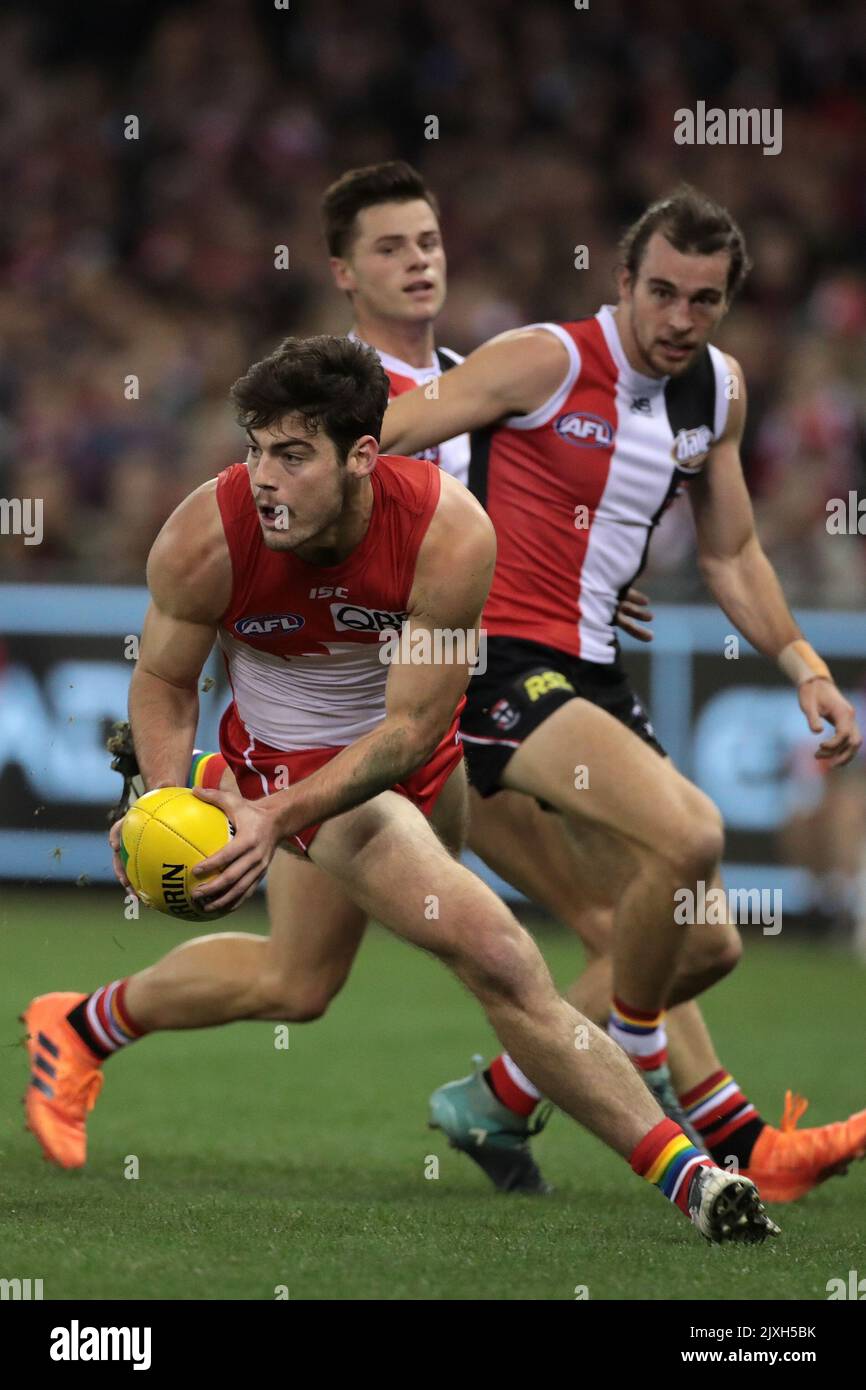 George Hewett of the Swans (left) gathers the ball during the Round 12 ...
