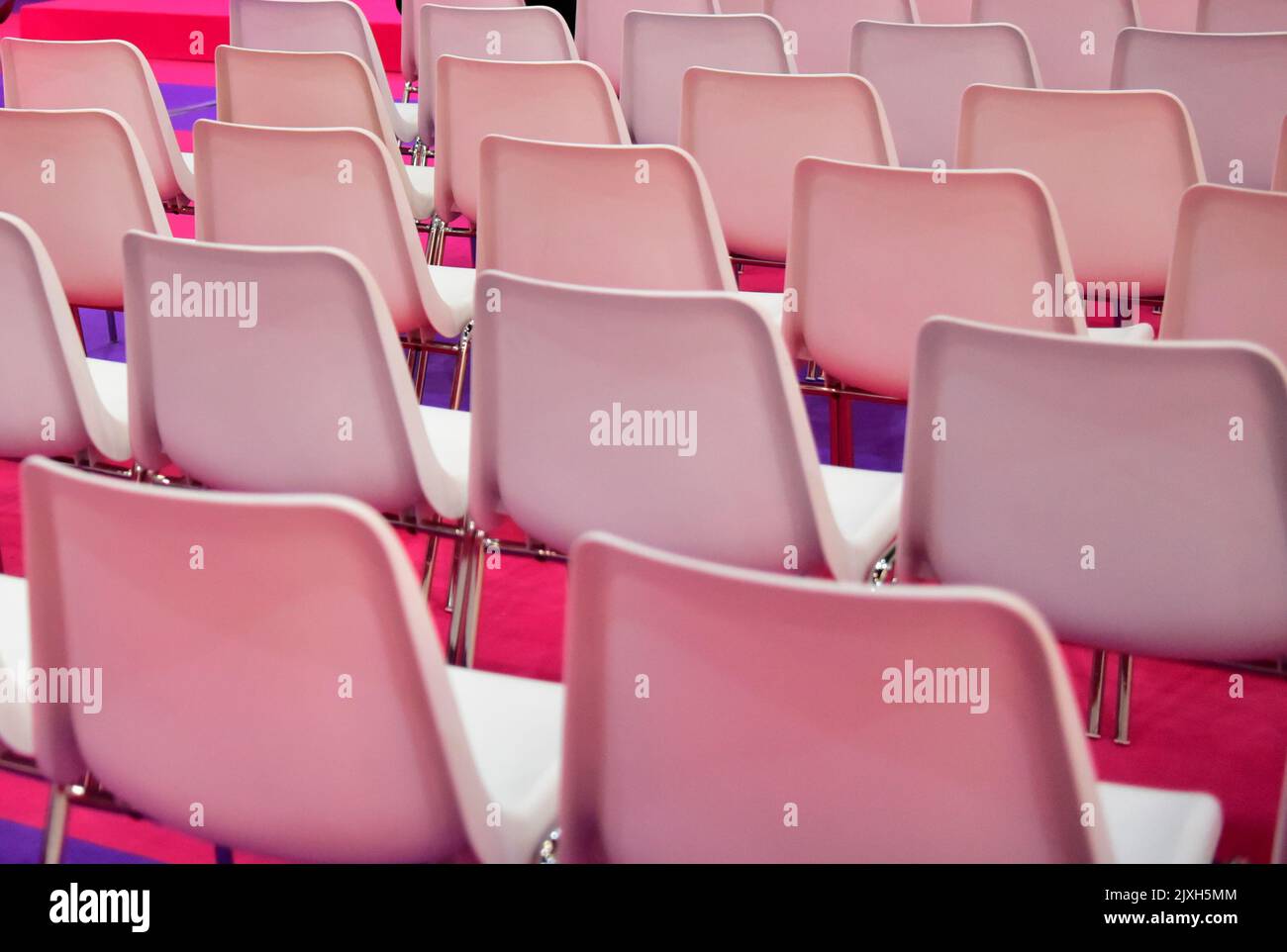 Symmetrical chairs for concert, cinema, event. concept Stock Photo - Alamy