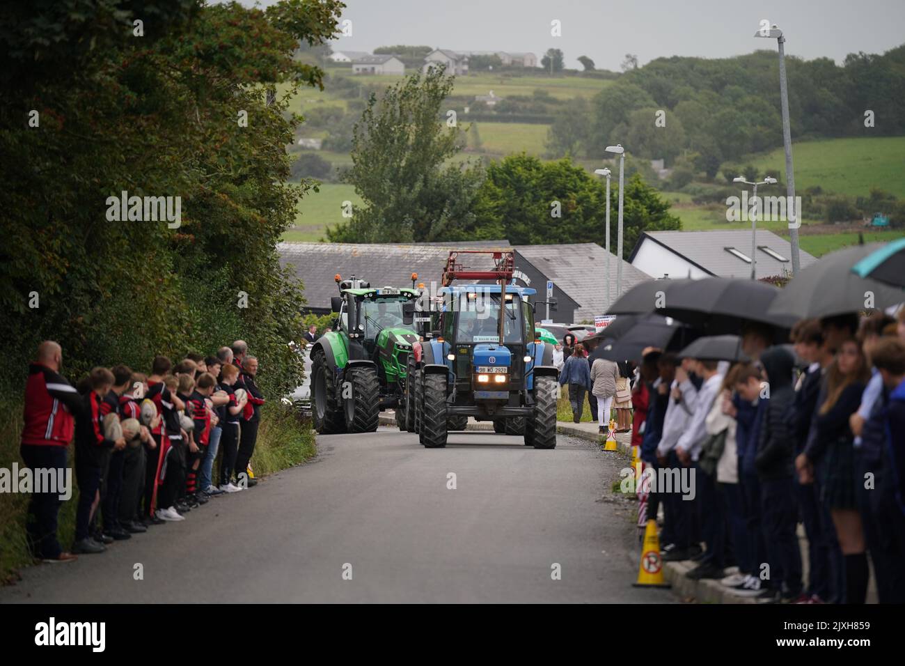 Three tractors precedes the hearse carrying the coffin of Jack de ...