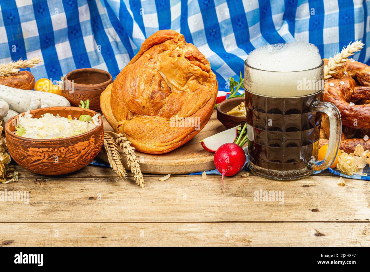 Traditional Oktoberfest set. Pretzels, beer, weisswurst, smoked pork ...