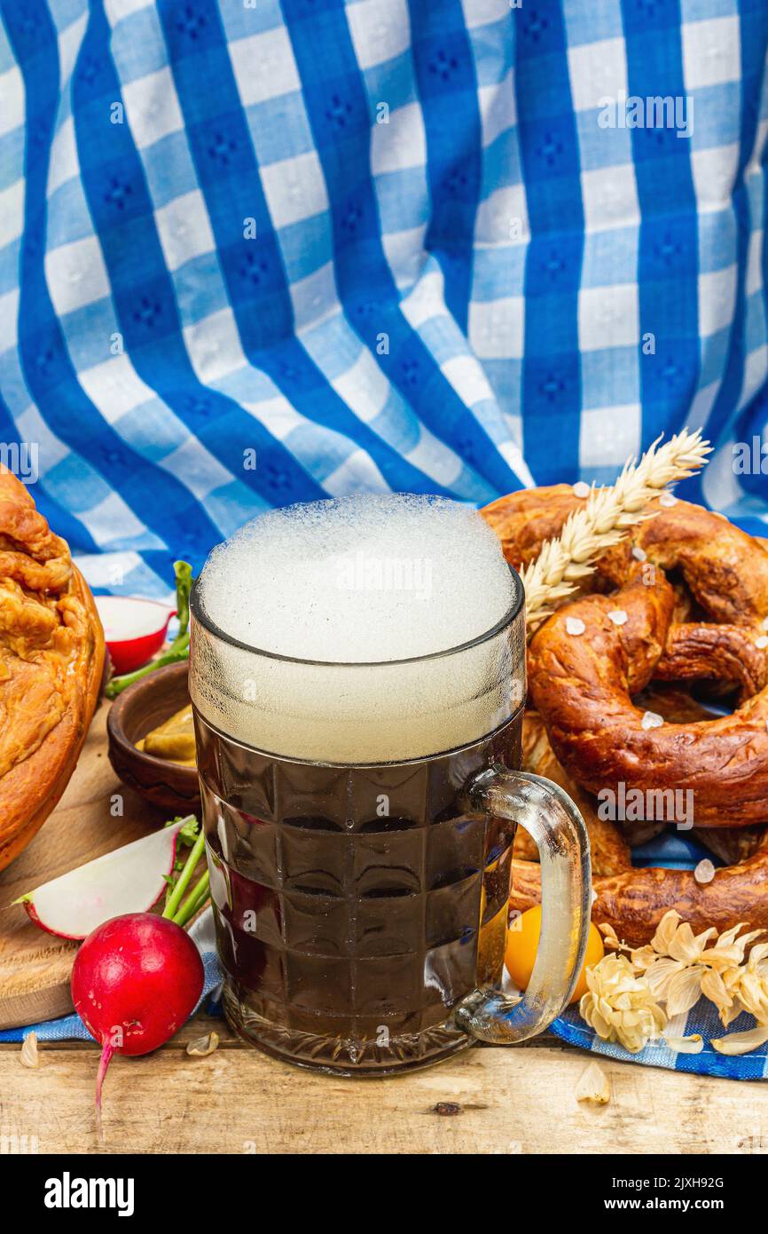 Traditional Oktoberfest set. Pretzels, beer, weisswurst, smoked pork ...