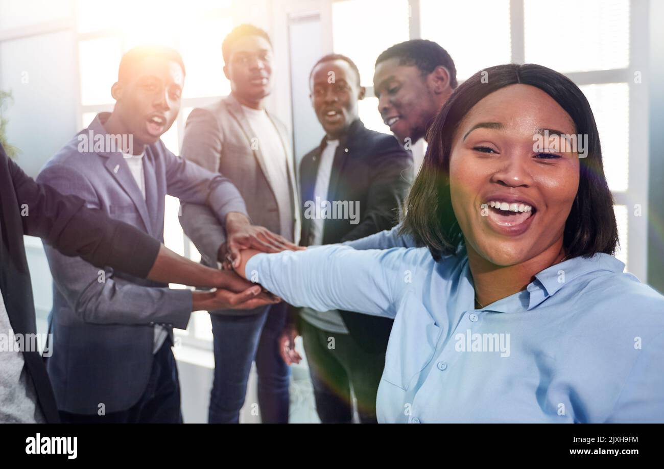 young business woman and her colleagues are showing their unity Stock ...