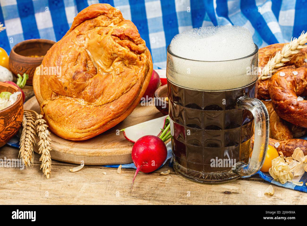 Traditional Oktoberfest set. Pretzels, beer, weisswurst, smoked pork ...