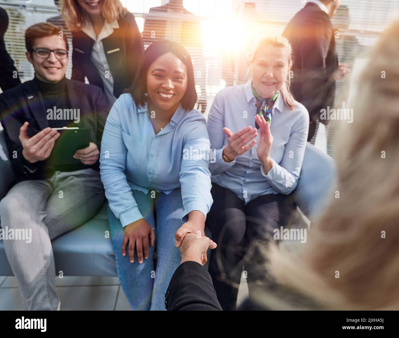 Great job. Successful business team is clapping their hands in modern ...