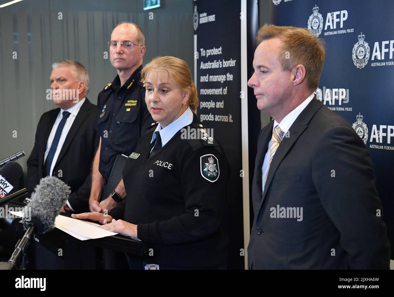 Queensland Police' Detective Superintendent Jon Wacker (left ...