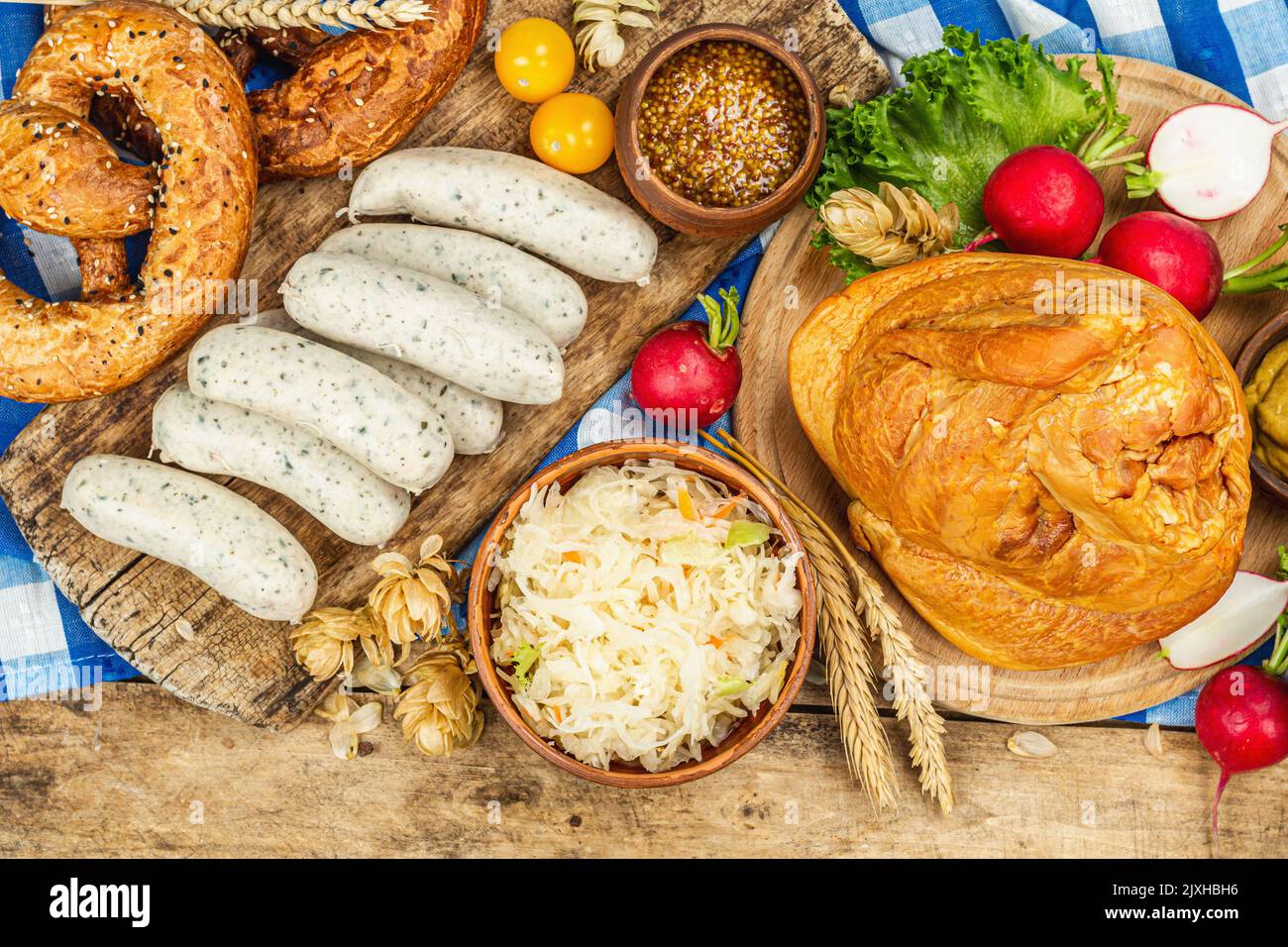 Traditional Oktoberfest set. Pretzels, beer, weisswurst, smoked pork ...