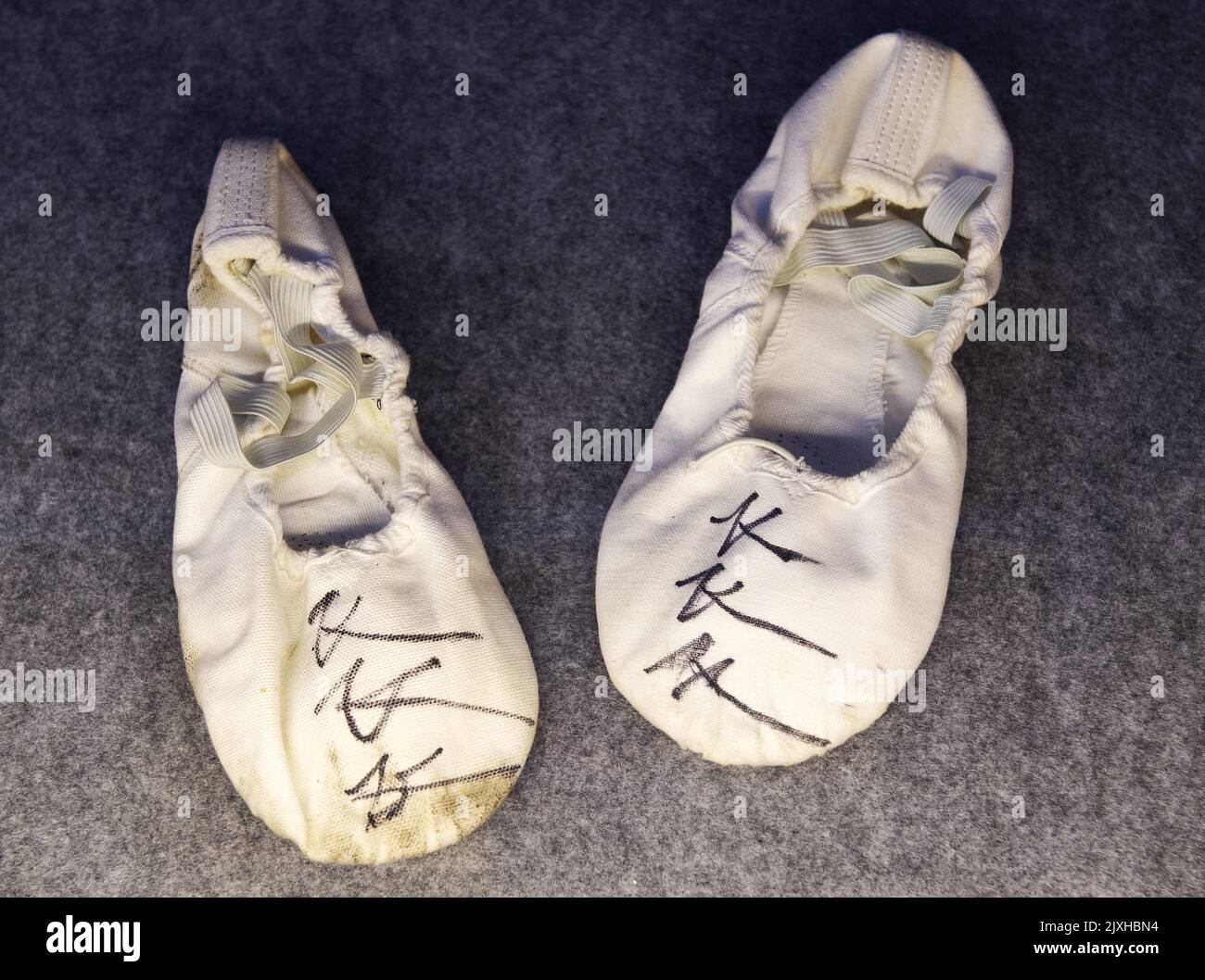 Ballet shoes worn by Li Cunxin as a child are seen on display during ...