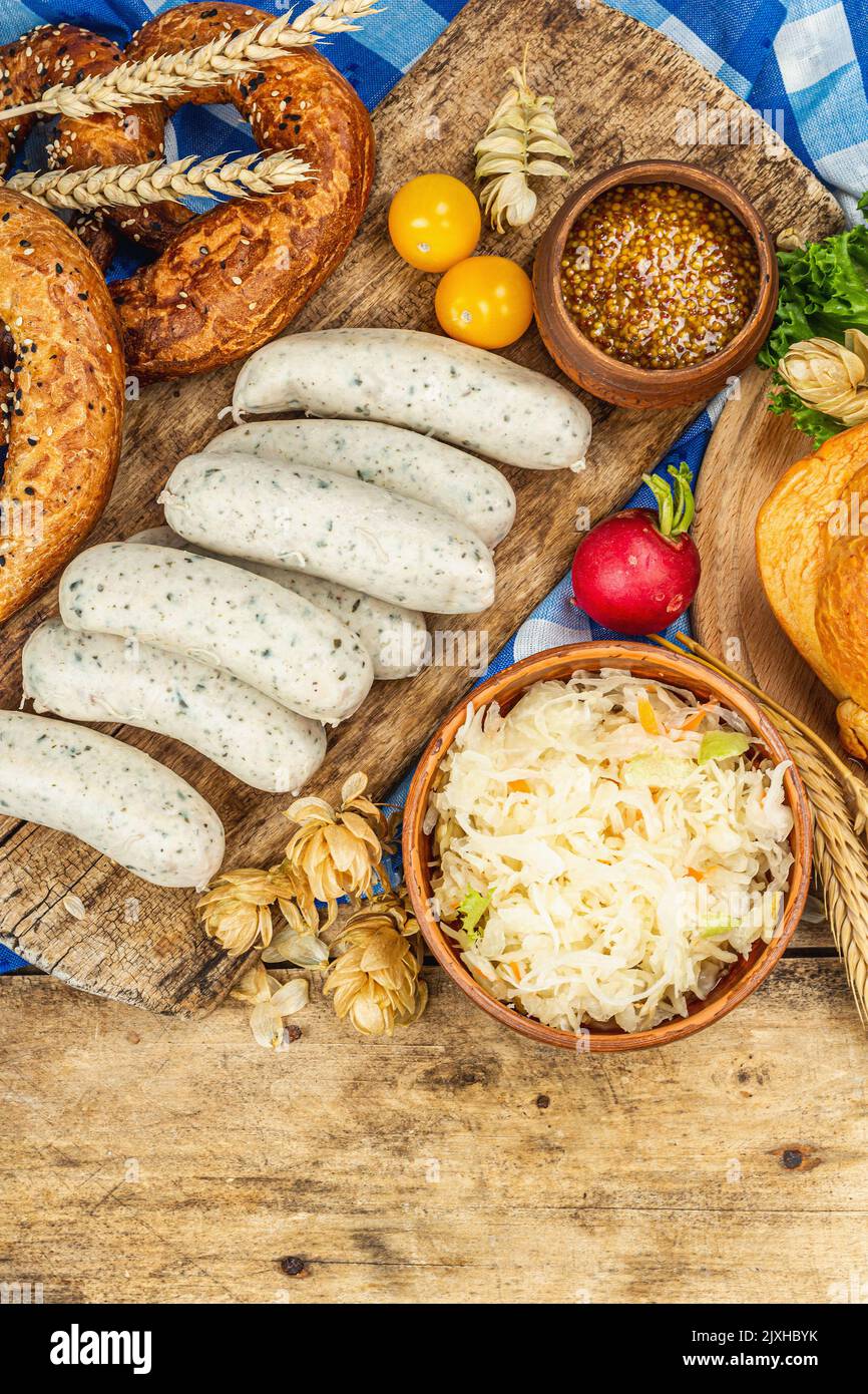 Traditional Oktoberfest set. Pretzels, beer, weisswurst, smoked pork ...