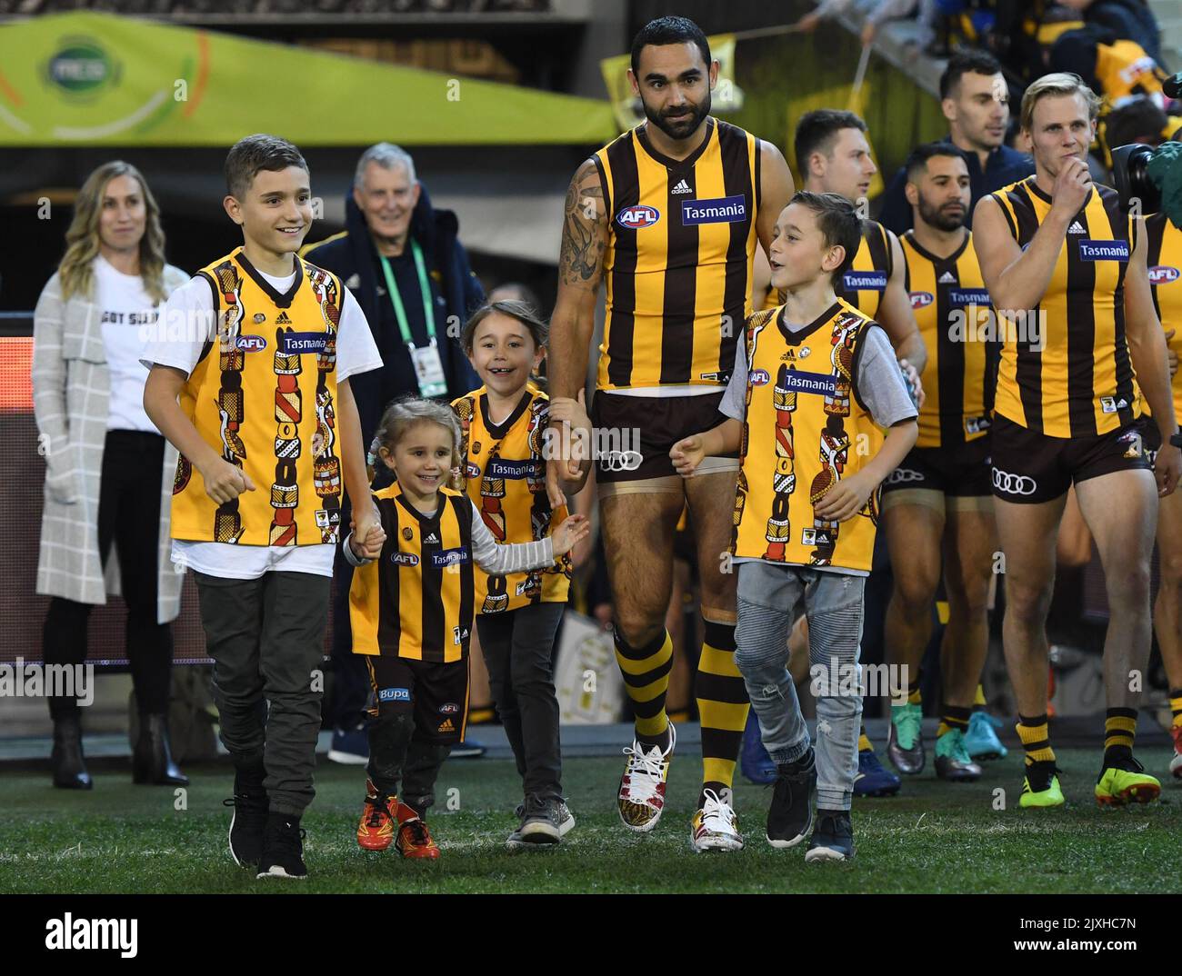 Shaun Burgoyne (sixth from left) enters the ground with his children ...