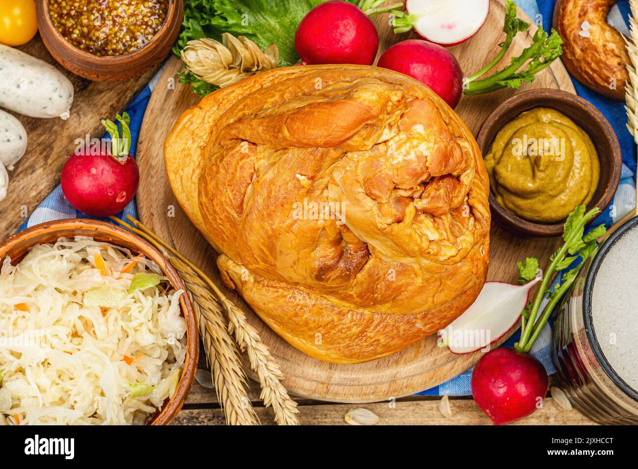 Traditional Oktoberfest set. Pretzels, beer, weisswurst, smoked pork ...