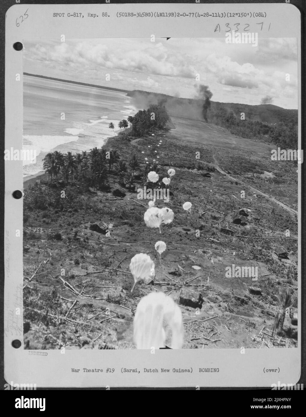 As smoke rises from bomb bursts, more parachute bombs fall toward ...