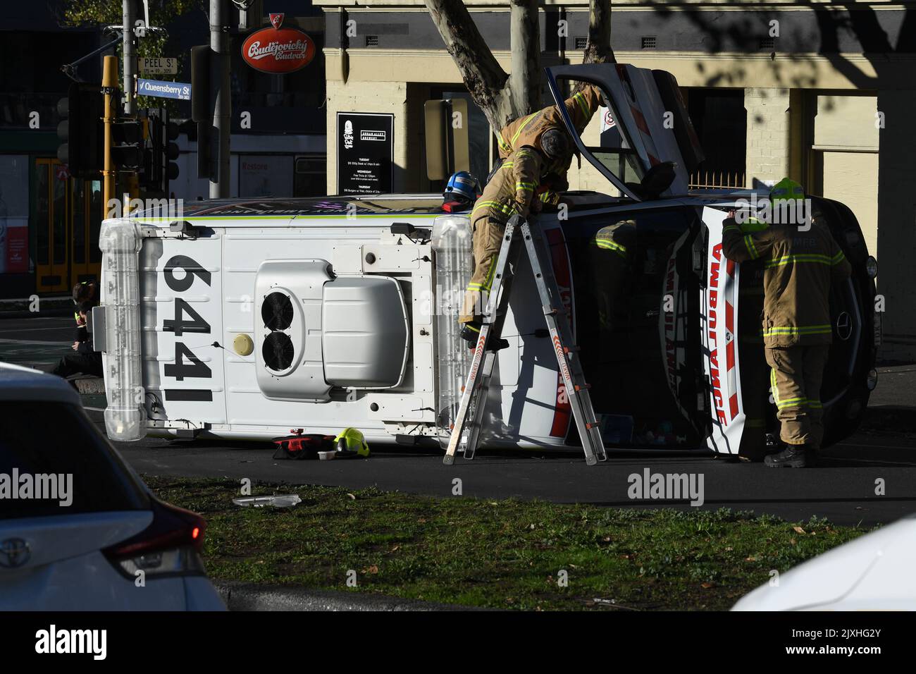 Metropolitan Firefighters attend to a Victorian Ambulance rollover on ...