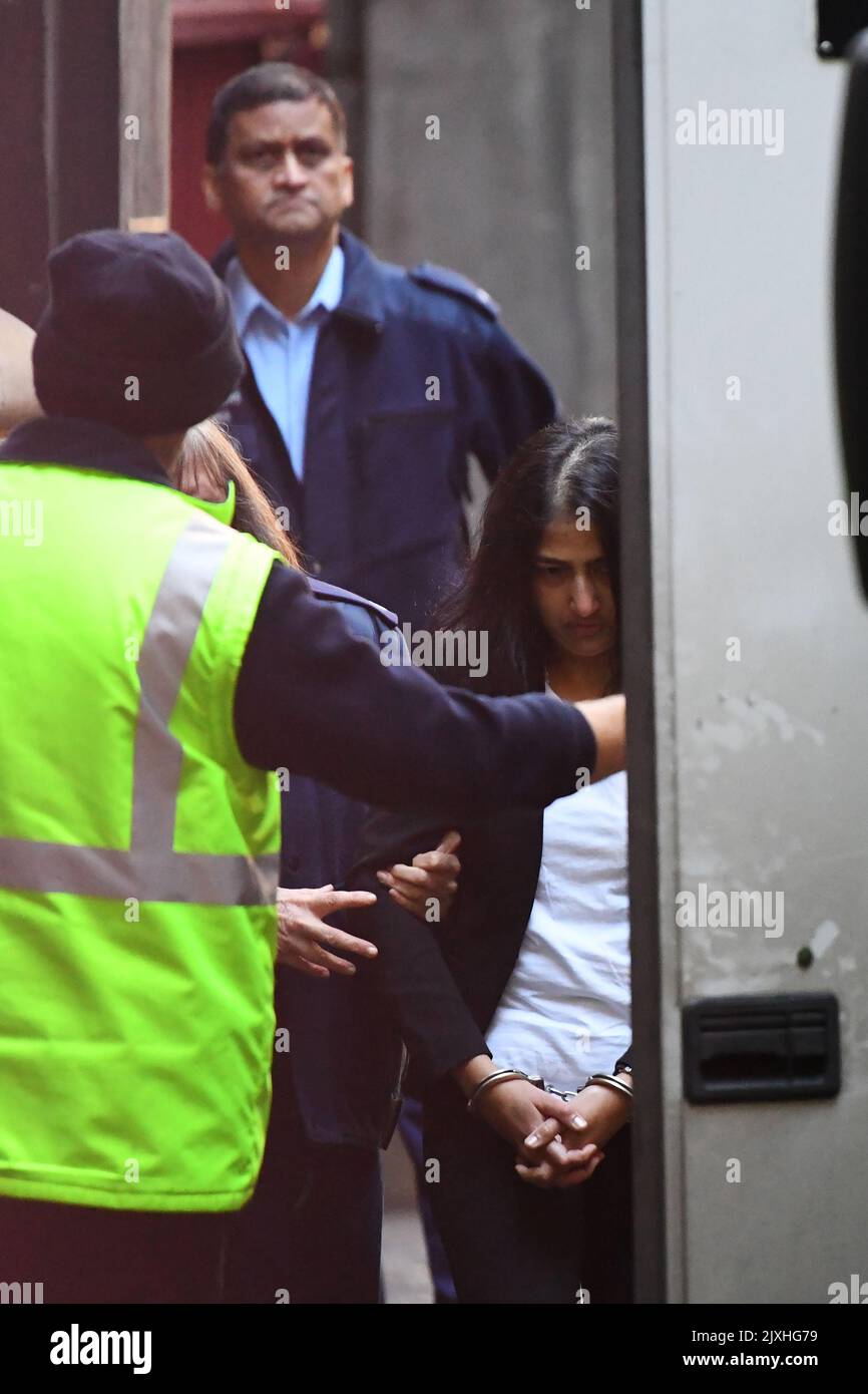 Sofia Sam (right) is seen entering a prison transfer van after appearing in the Court of Appeal ...
