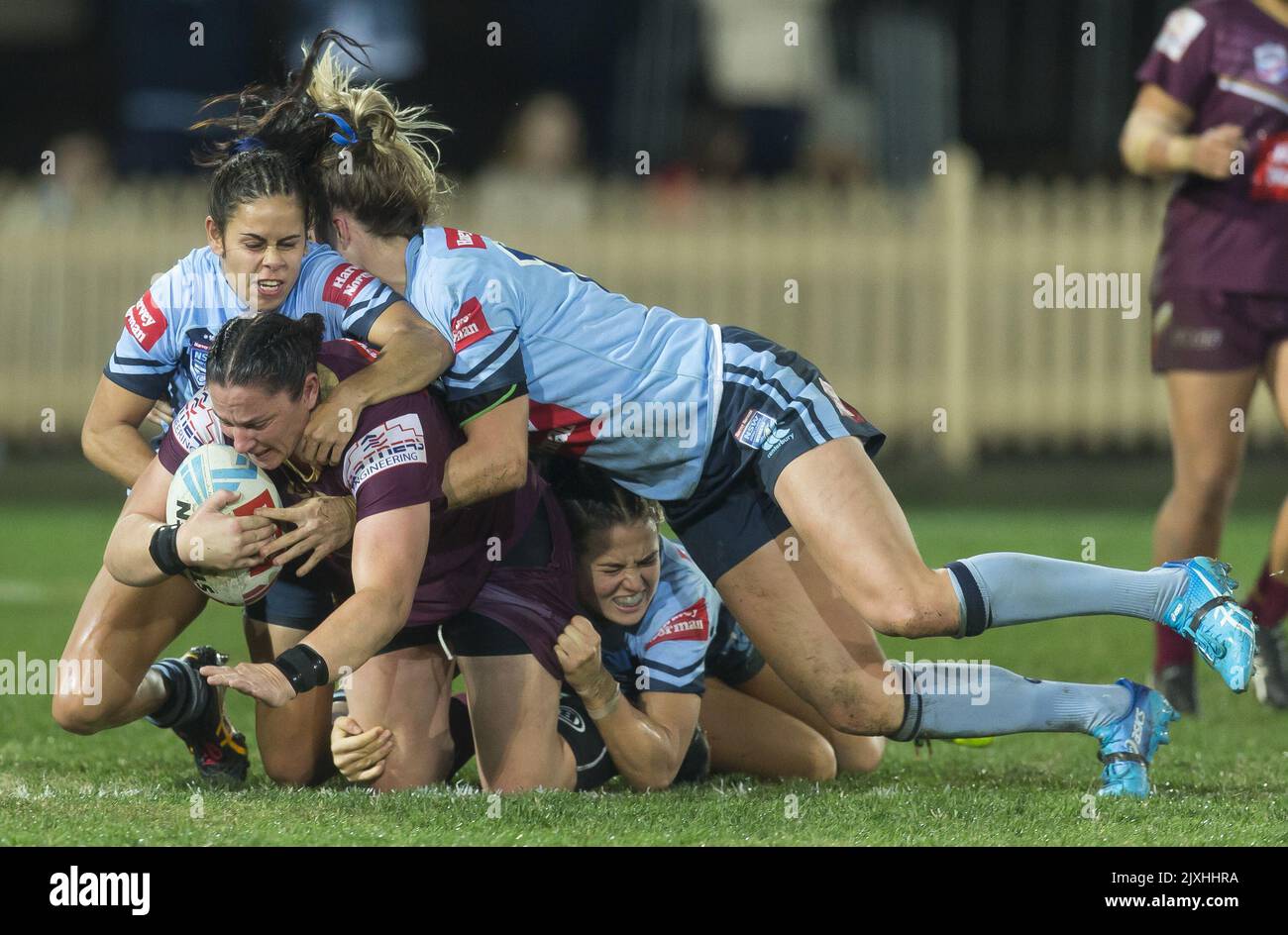 Stephanie Hancock of the Maroons is tackled during the Women's State of ...