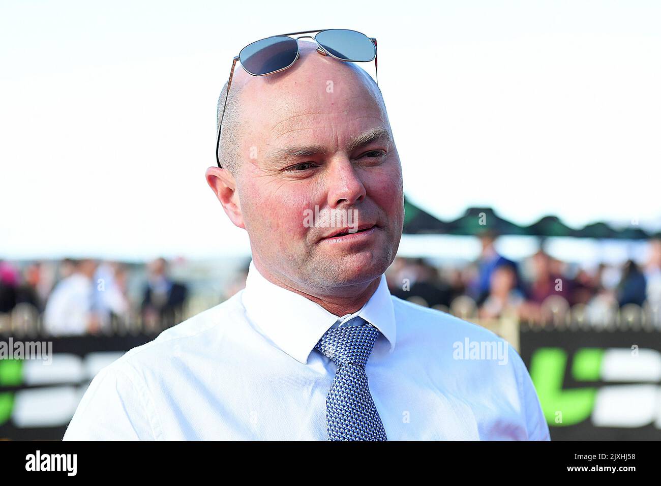 Trainer Matthew Dunn is seen after jockey Jim Byrne rode Divine Unicorn ...