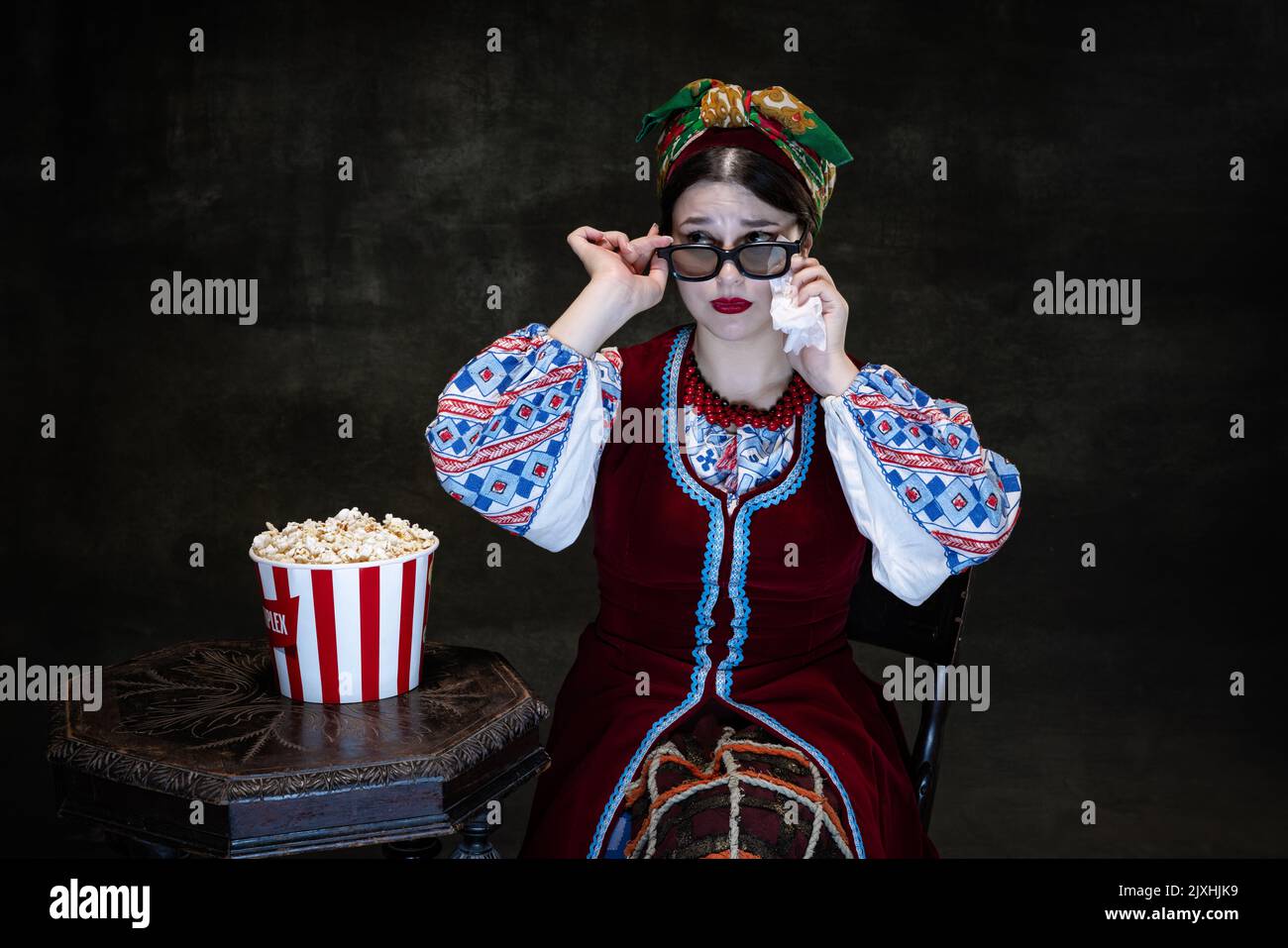 Crying beautiful Ukrainian woman wearing traditional folk costume ...