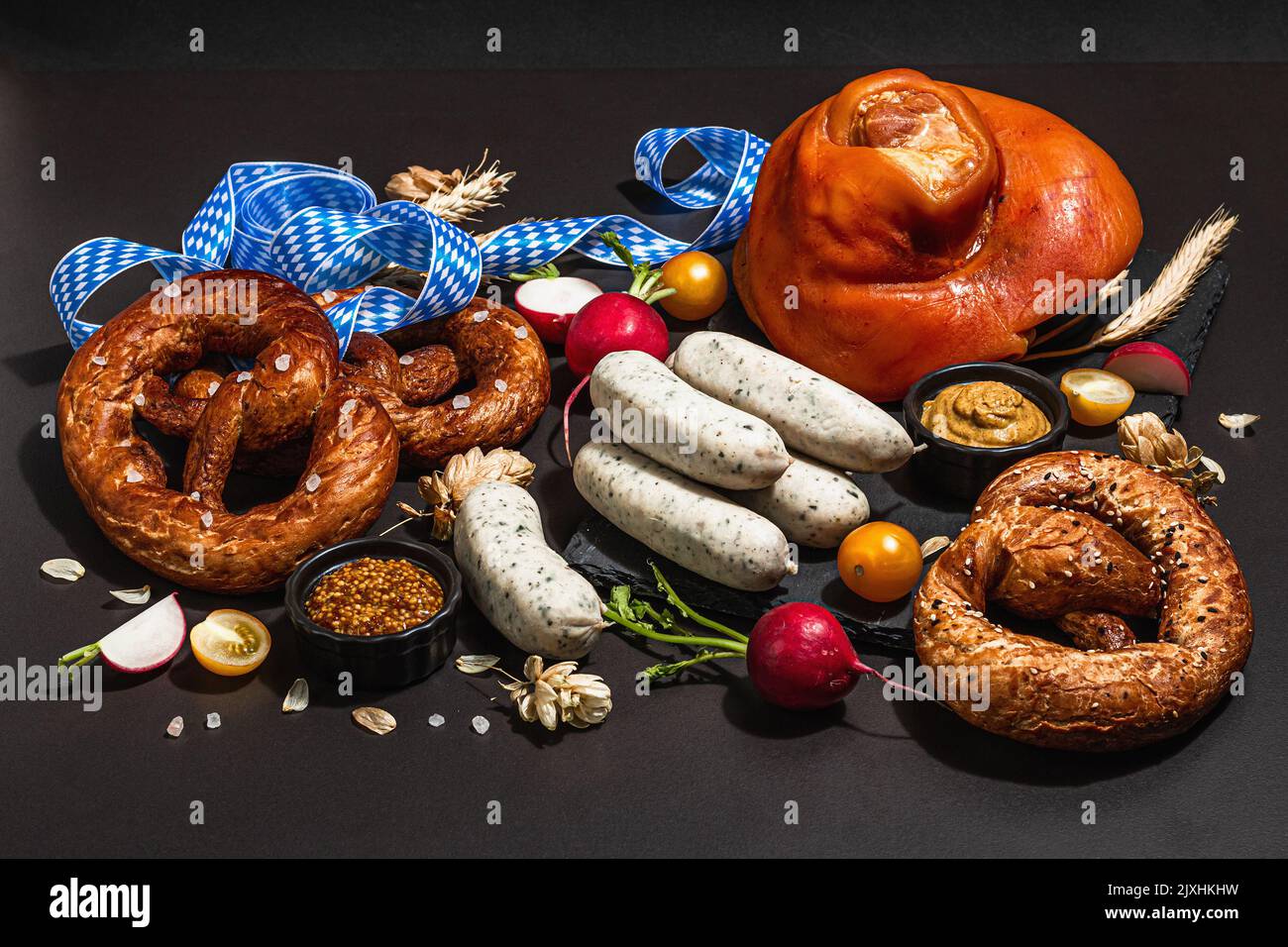 Traditional Oktoberfest set. Pretzels, weisswurst, smoked pork knuckle ...