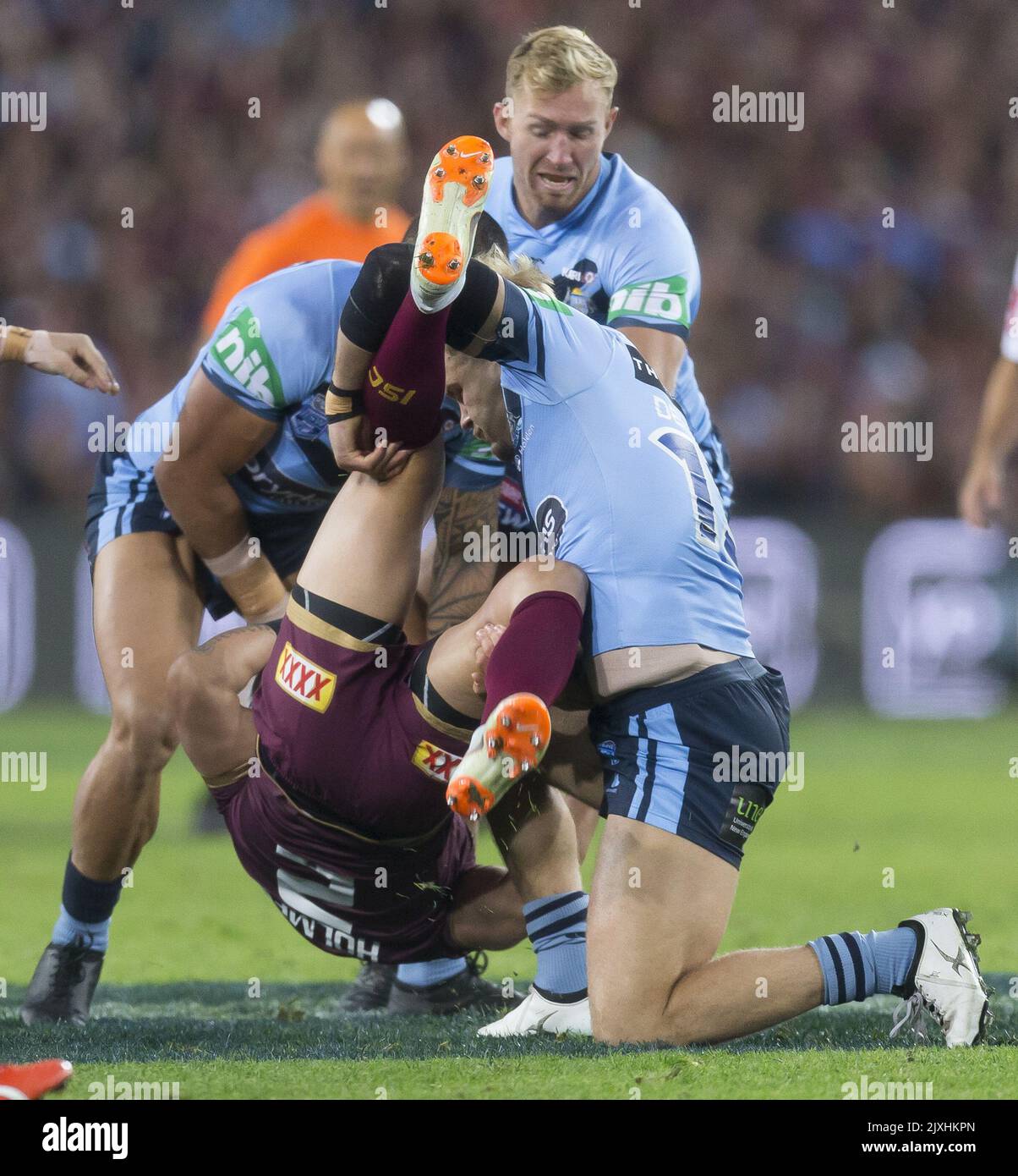 Valentine Holmes of the Queensland Maroons is tackled during Game 2 of ...