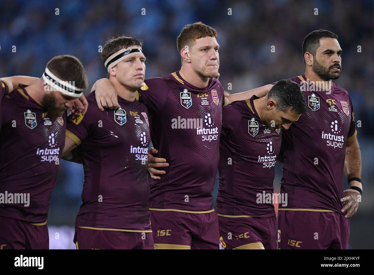 Queensland Maroons players sing the national anthem during Game 2 of ...
