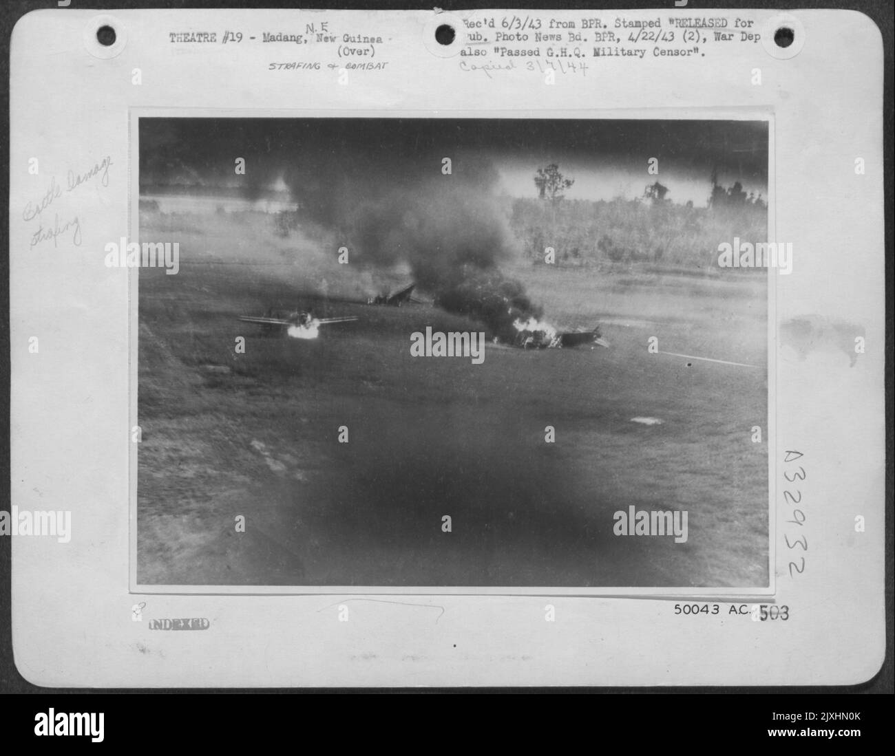 Japaneseanese aircraft blazing on Madang airdrome during Friday's ...