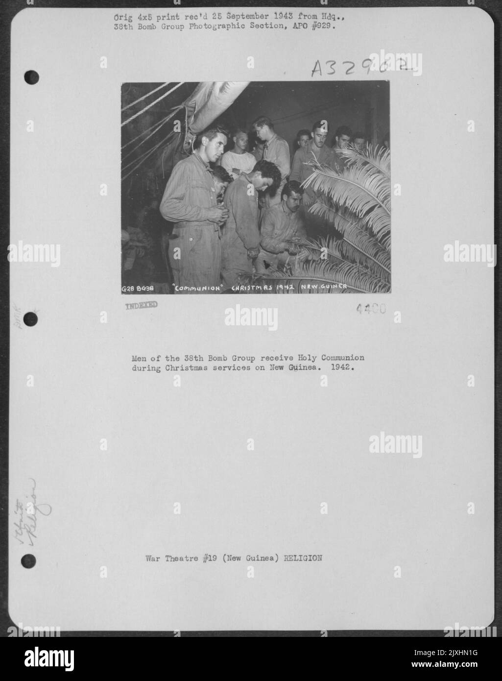 Men of the 38th Bomb Group receive Holy Communion during Christmas ...