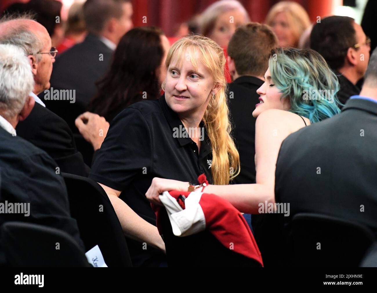 Former Olympic swimmer Jessica Schipper (centre) attends the memorial ...