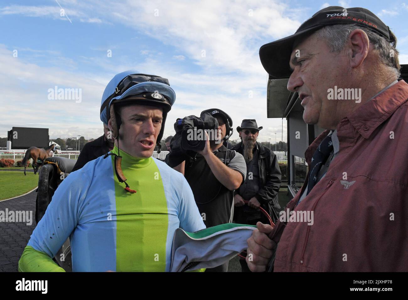 Jockey Jay Ford is seen with foreman Nick Rowland after riding Ducale ...
