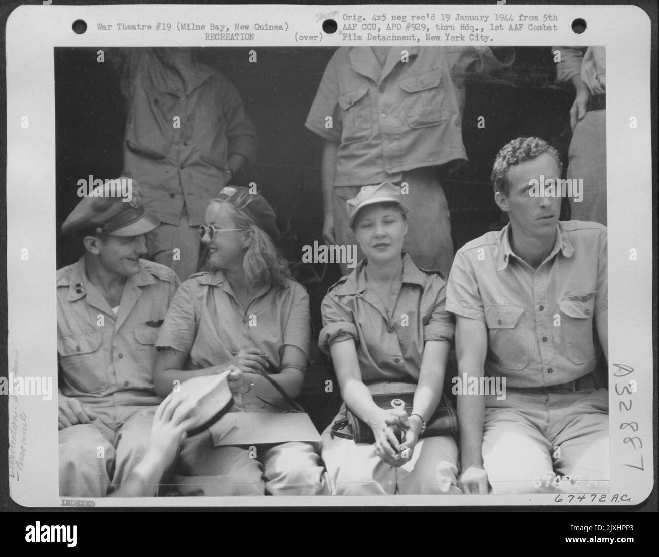 Two members of Gary Cooper's U.S.O. tour sit in the doorway of the ...