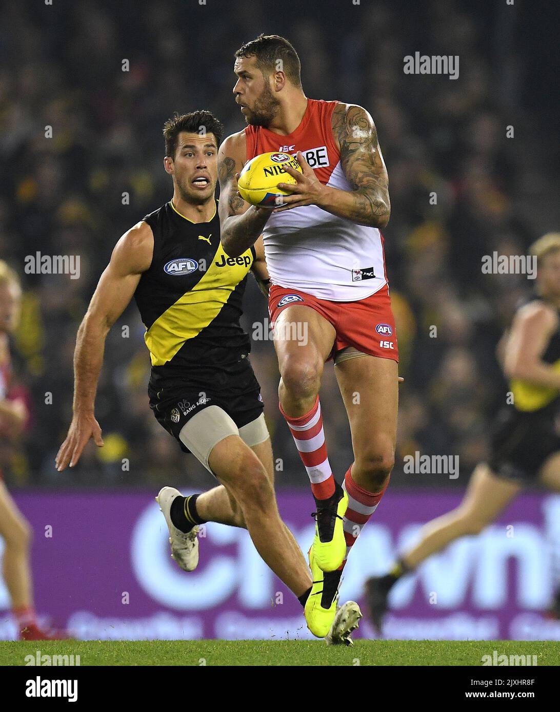 Lance Franklin of the Swans (right) and Alex Rance the Tigers contest ...