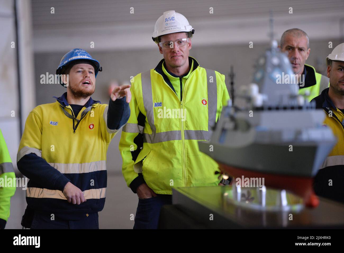 ASC workers look at a model of a Hunter Class Frigate before Prime ...