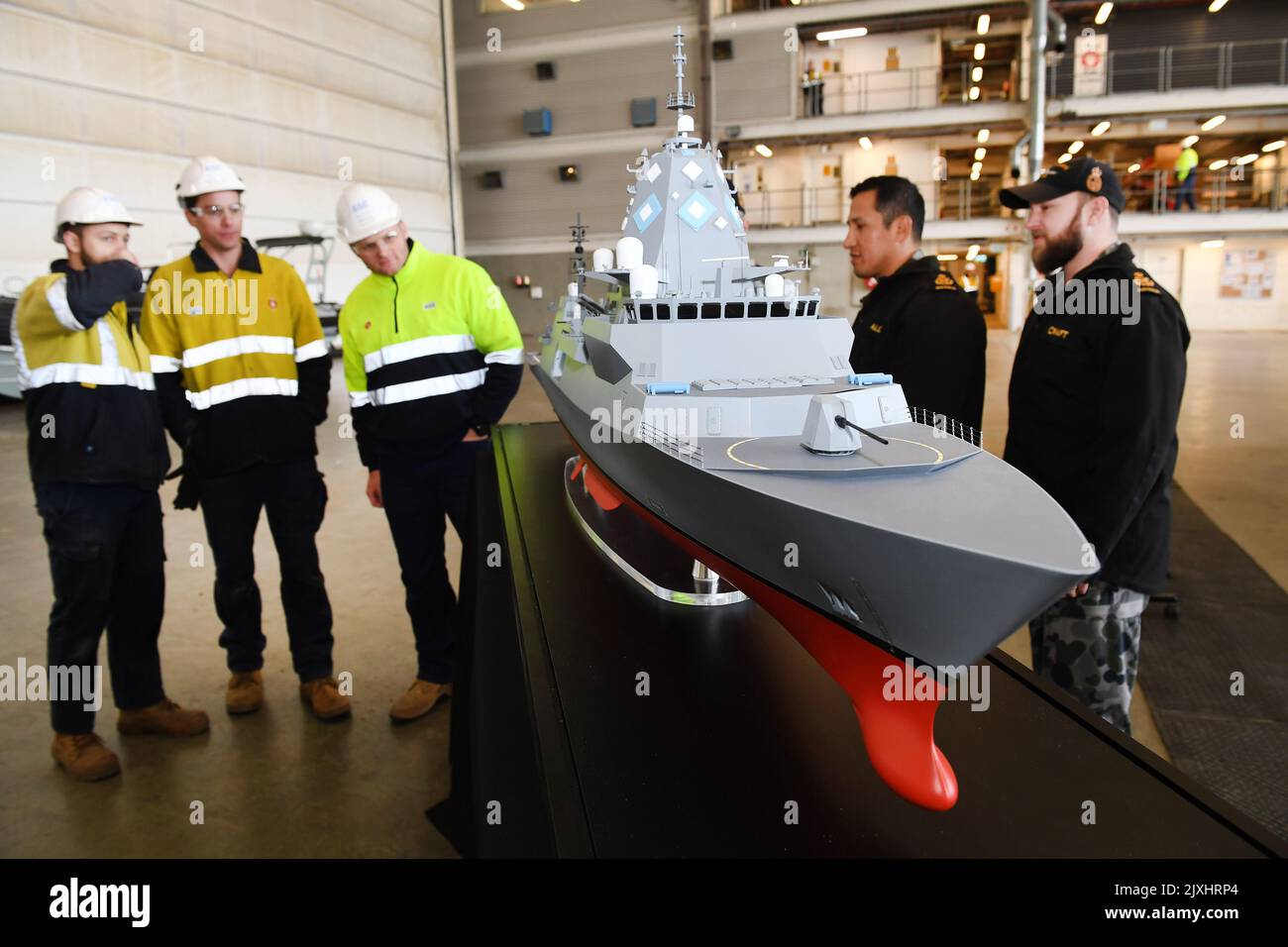 ASC workers and Navy personnel get their first look at a model of the ...