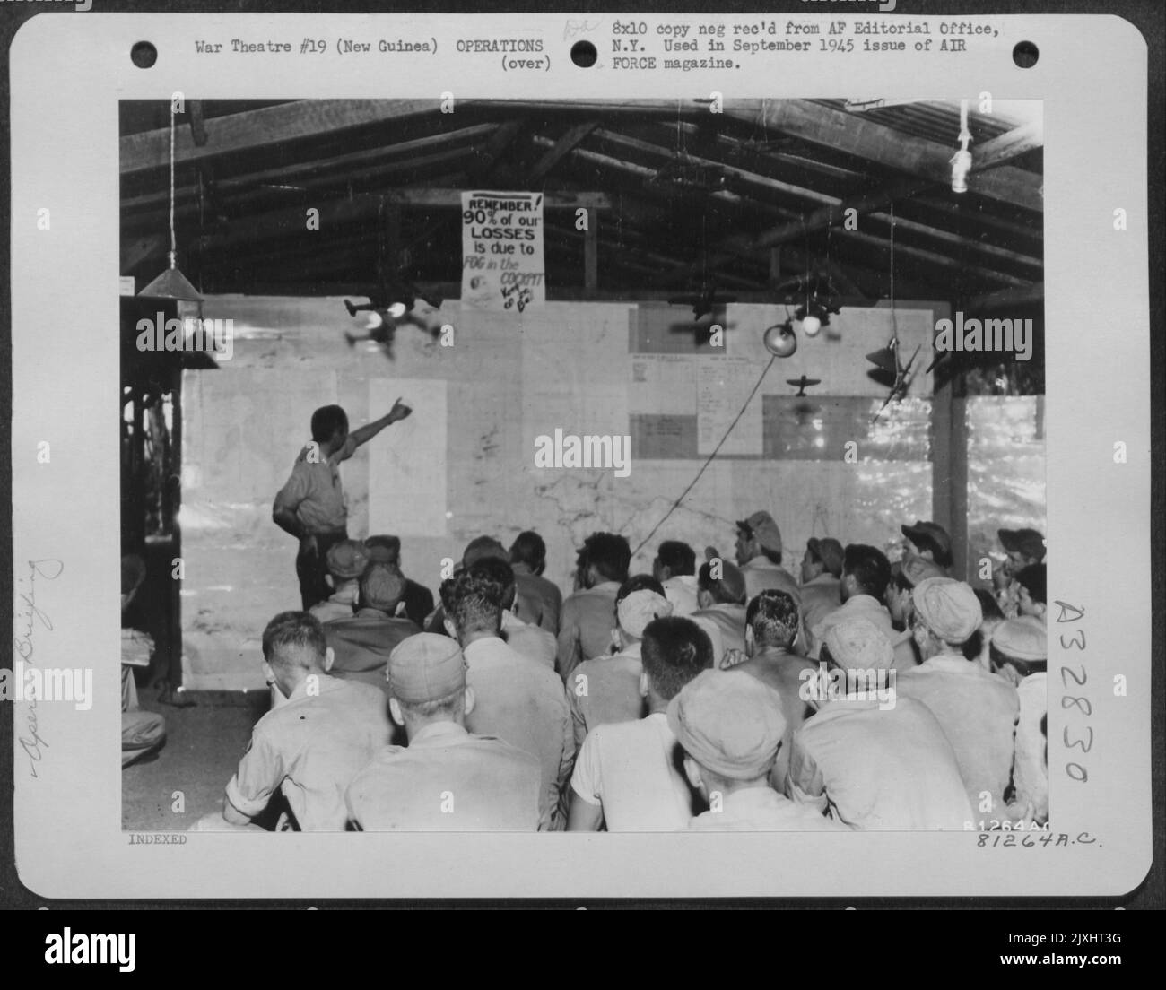 An intelligence officer is shown briefing aircrew members just before ...
