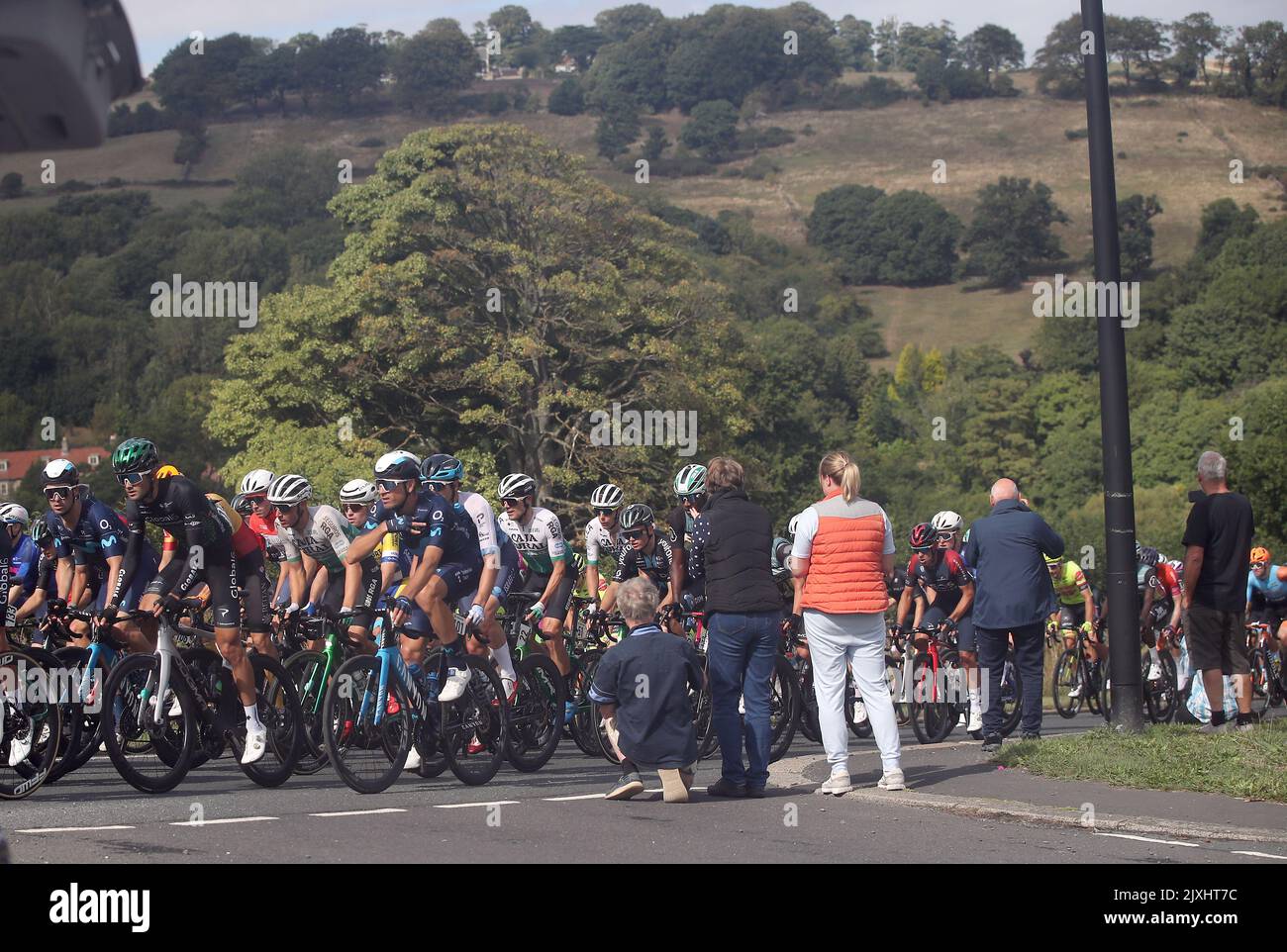 The peloton passes through the village of Sleights near Whitby during ...