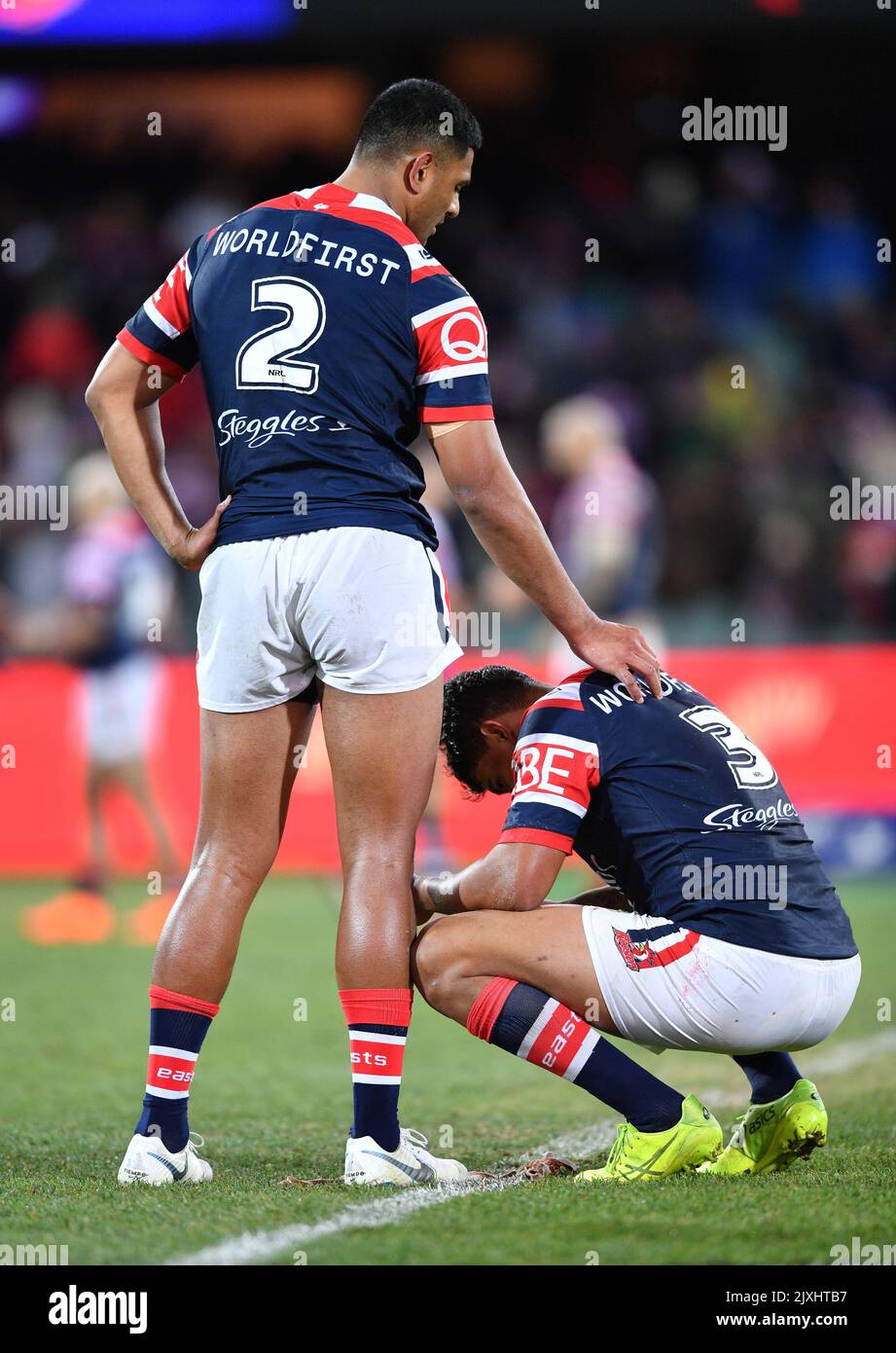 Daniel Tupou (left) comforts Latrell Mitchell of the Roosters after the ...