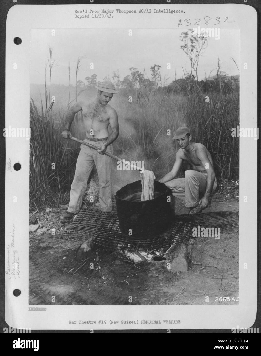 Two 8th Squadron pilots doing their daily laundry in New Guinea. Left ...