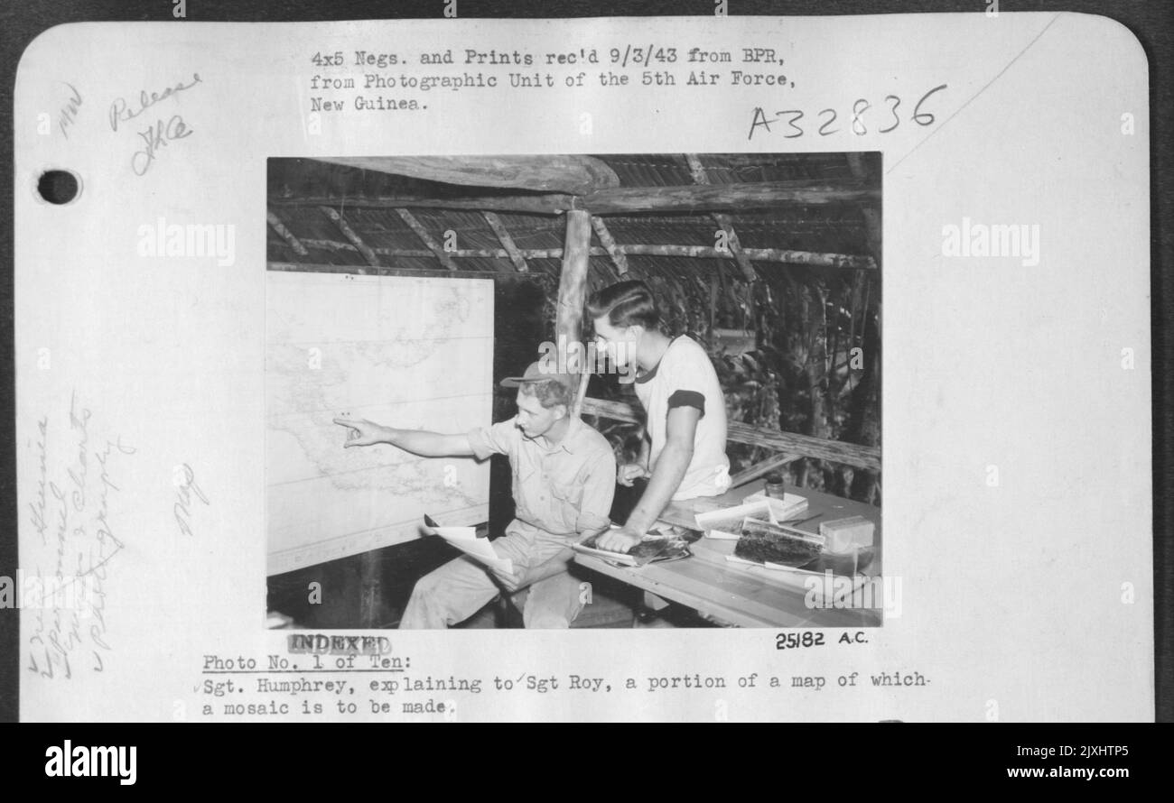 Sgt. Humphrey, explaining to Sgt Roy, a portion of a map of which a ...