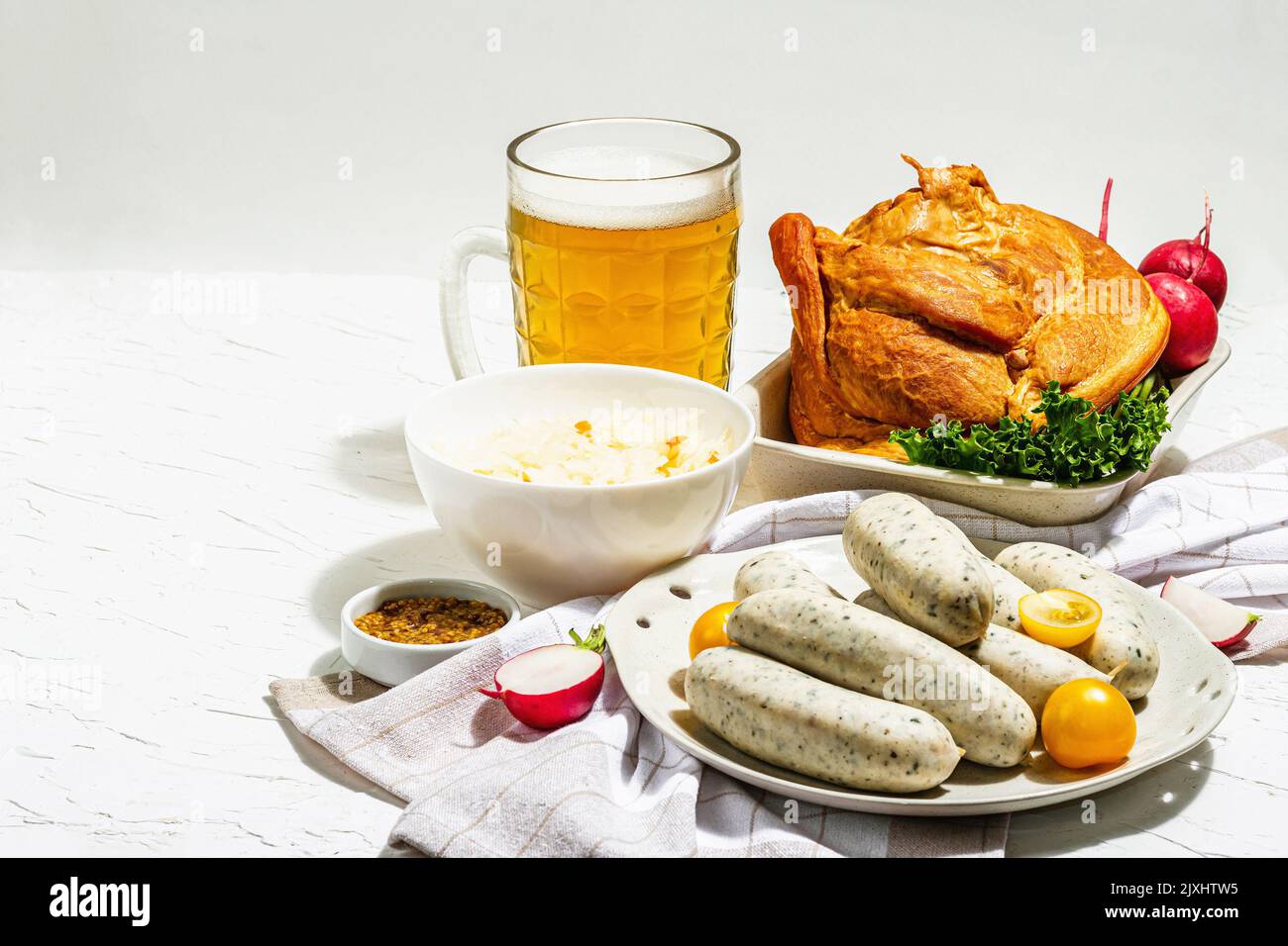 Traditional Oktoberfest set. Beer, weisswurst, smoked pork knuckle ...