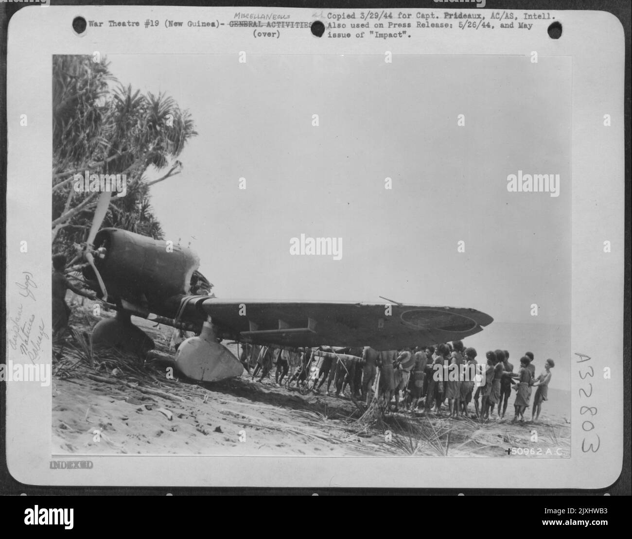 Japaneseanese Aichi 99 "Val" is dragged up on a New Guinea Beach by ...