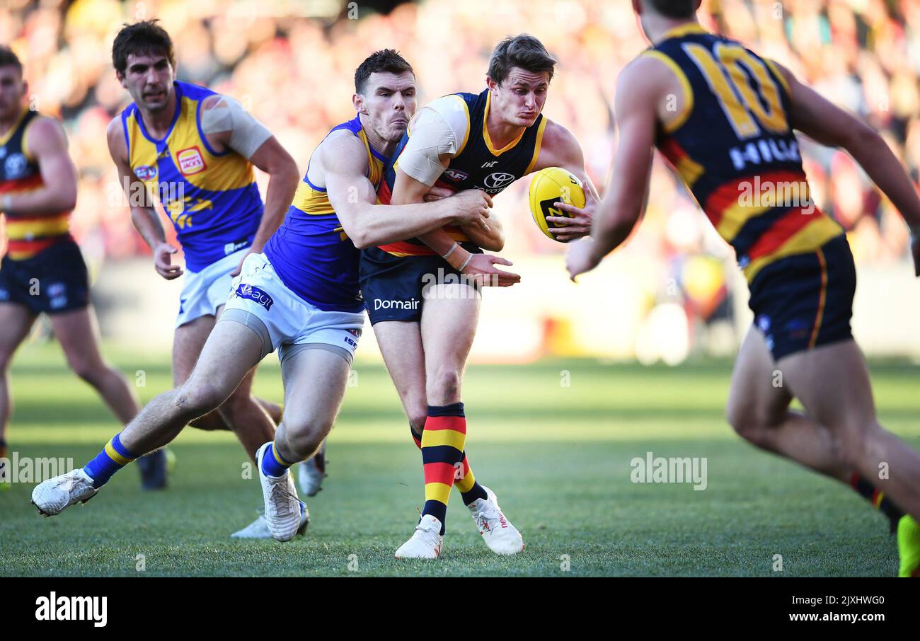 Luke Shuey of the Eagles tackles Matt Crouch of the Crows during the ...