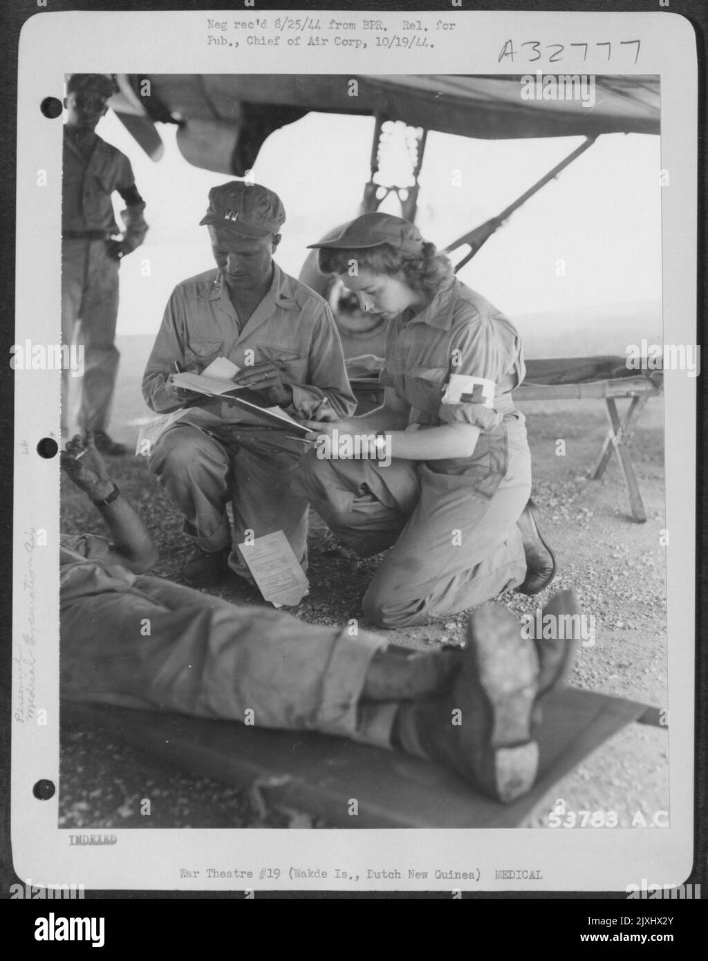 WAKDE ISLAND-Capt. Berg and Lt. Patricia Thompson checking the case ...