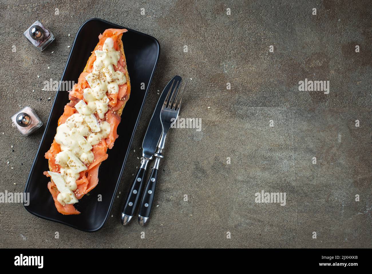 Traditional Spanish breakfast. Tostada with different toppings on a ...