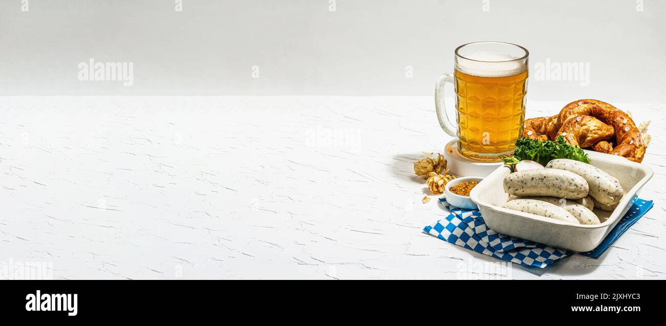 Traditional Oktoberfest set. Pretzels, beer, weisswurst with mustard ...