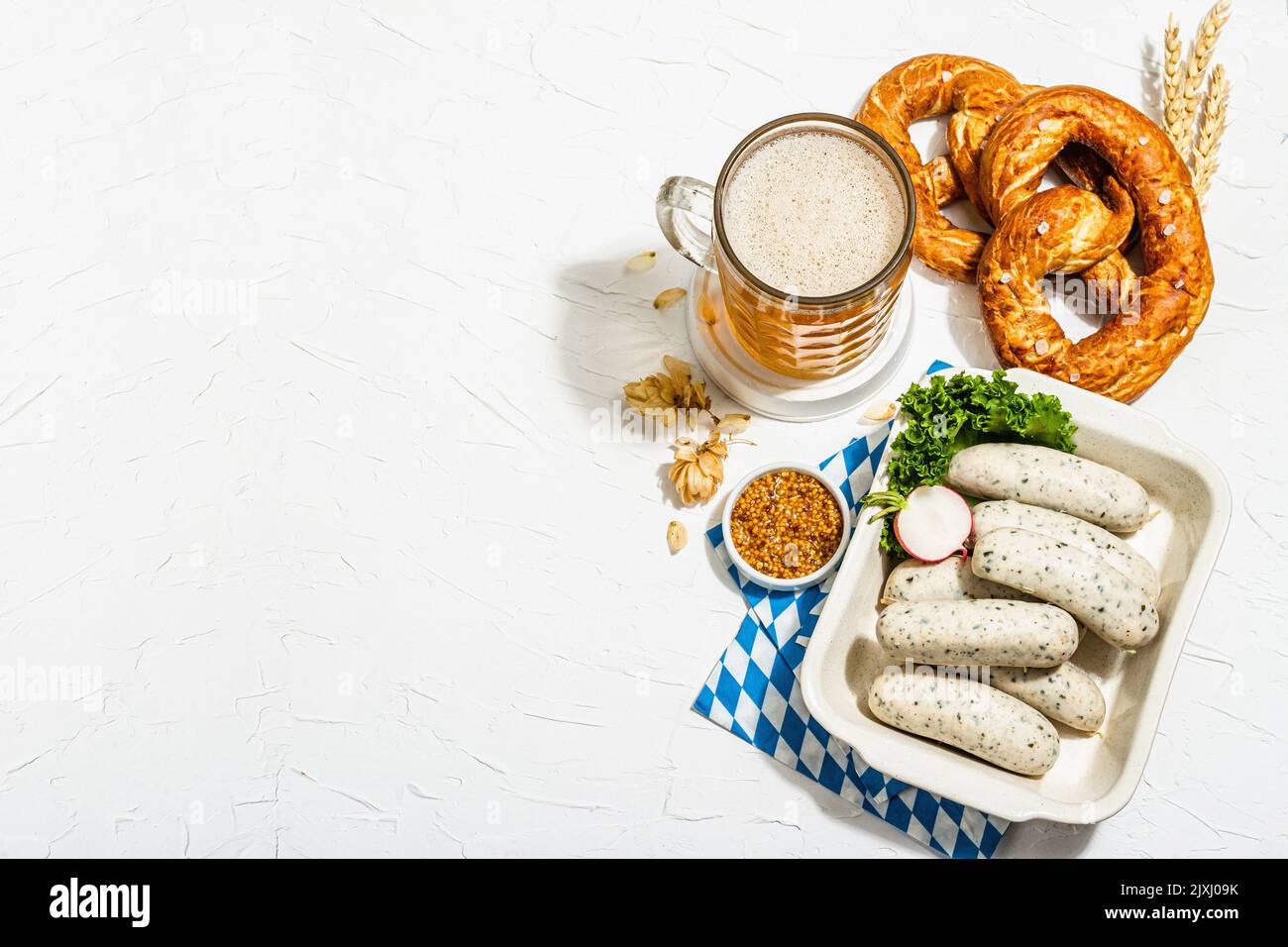 Traditional Oktoberfest set. Pretzels, beer, weisswurst with mustard ...