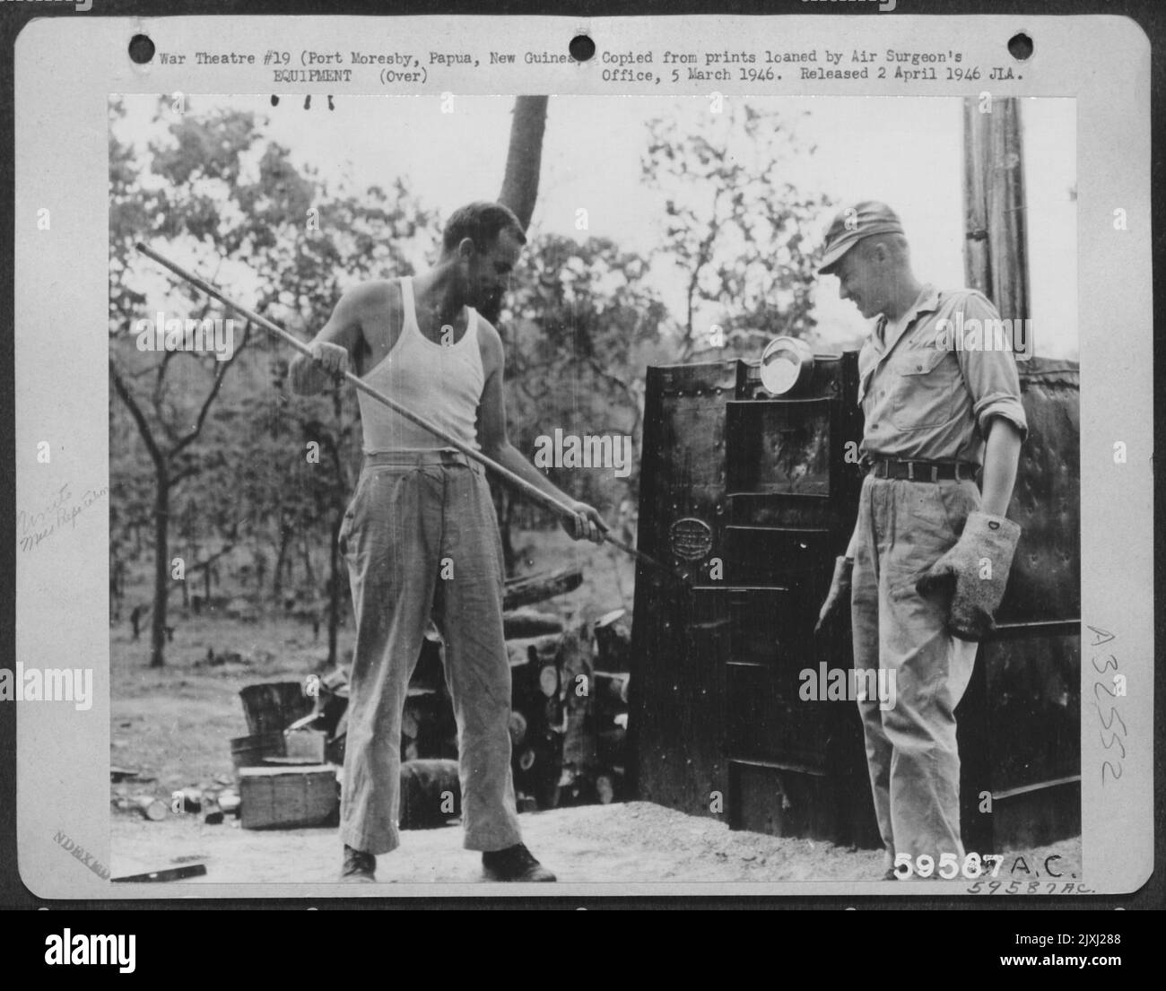 Taking hot rolls from the oven of the 38th Bomb Group, 822nd Bomb ...