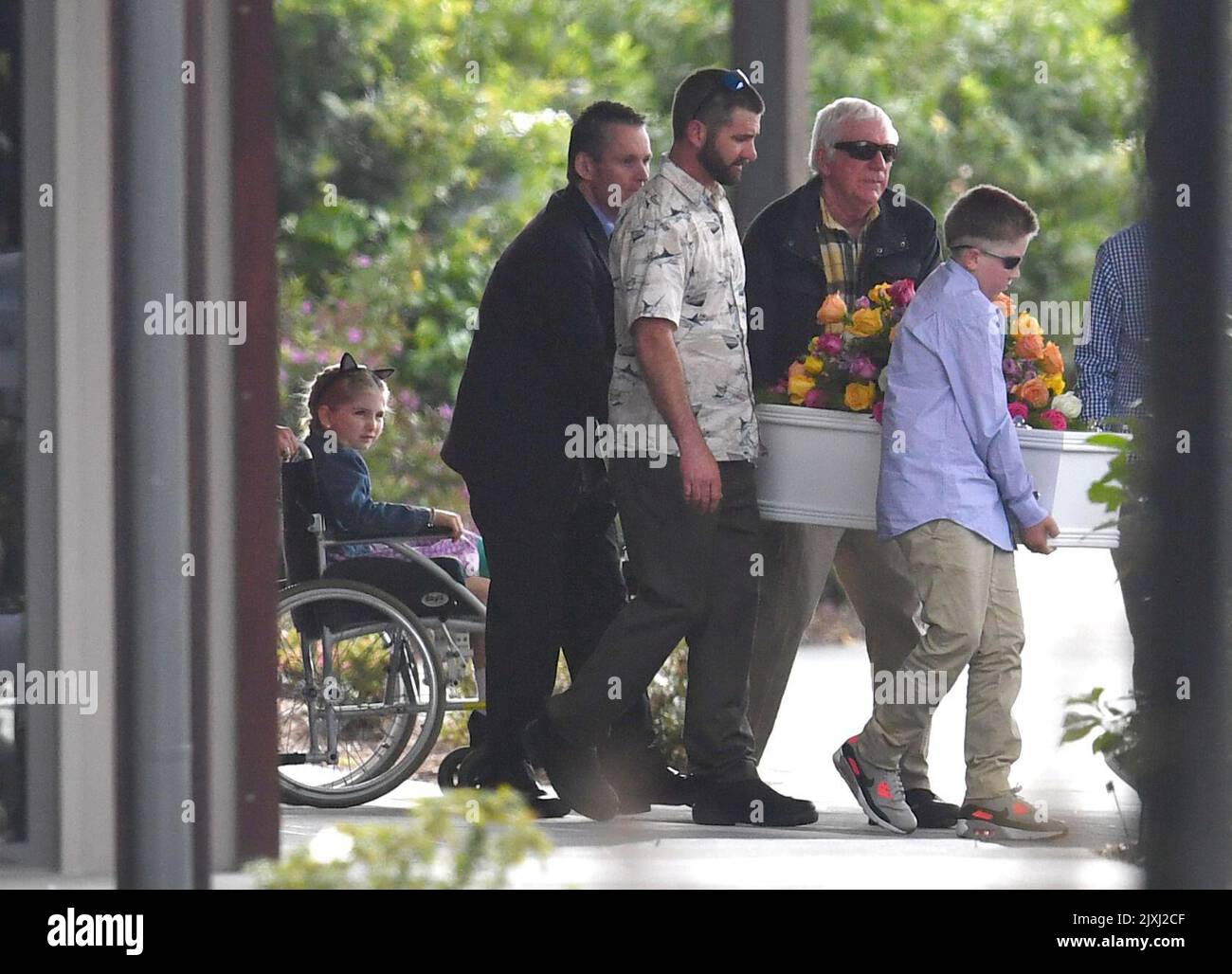 Family and friends are seen carrying the coffin of Indie Armstrong at ...